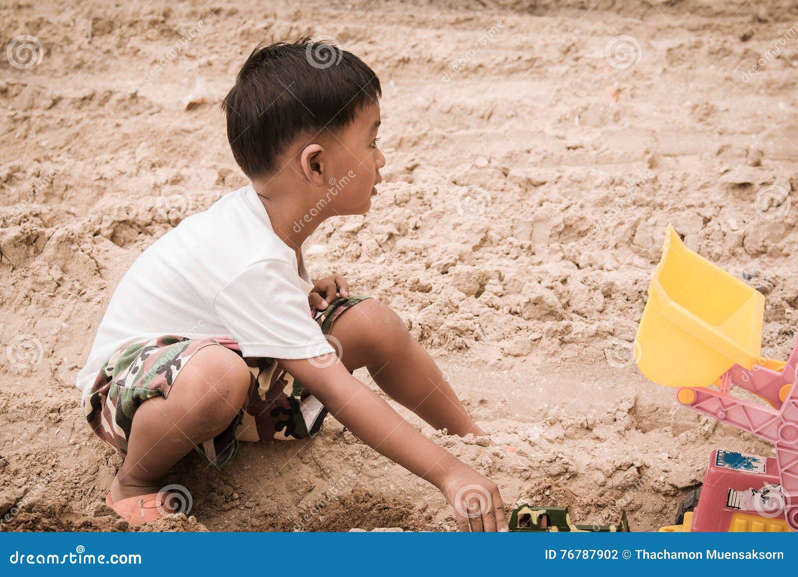 Cute little boy play sand stock photo. Image of child - 76787902