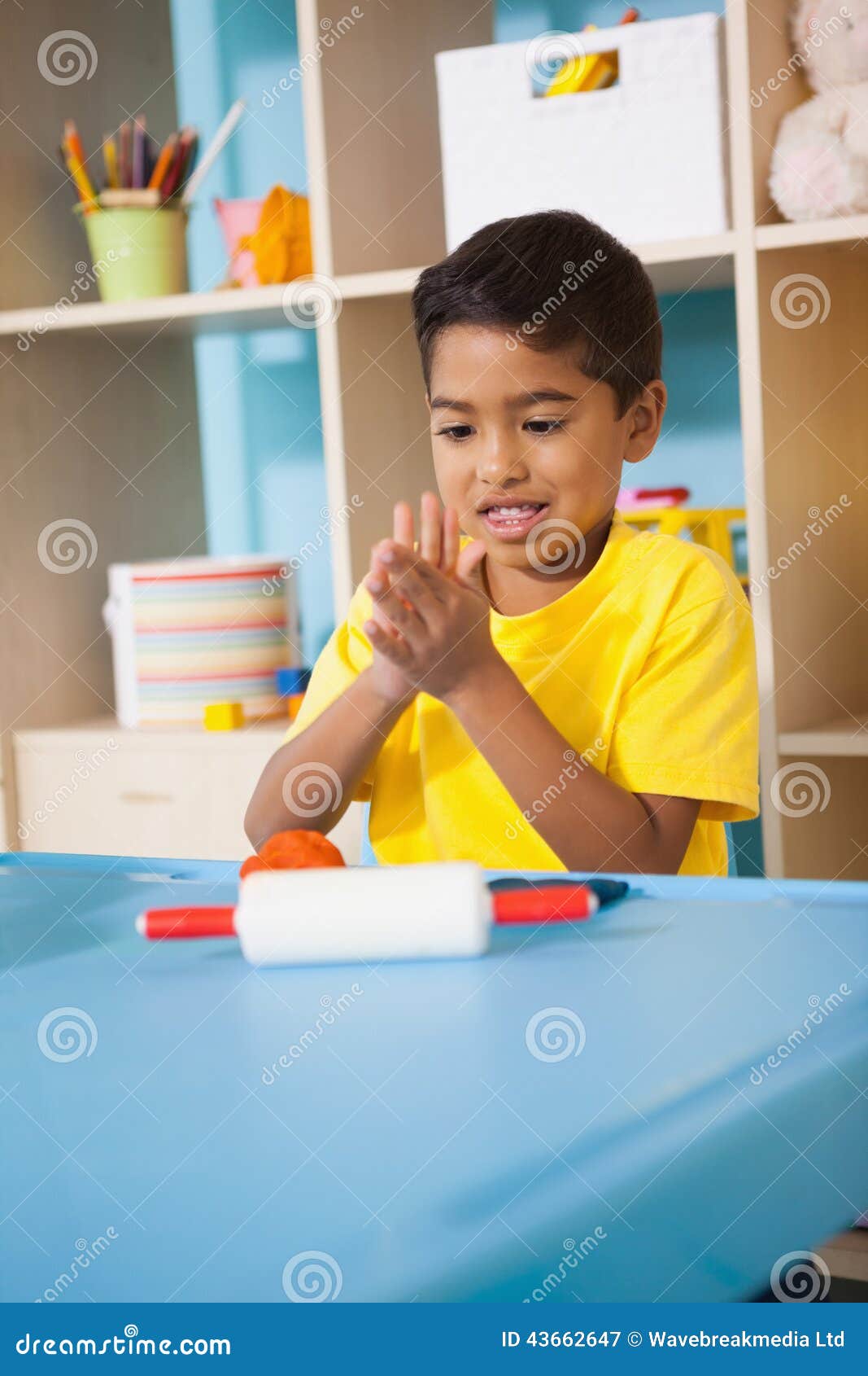 Cute Little Boy Playing with Modelling Clay in Classroom Stock Image ...