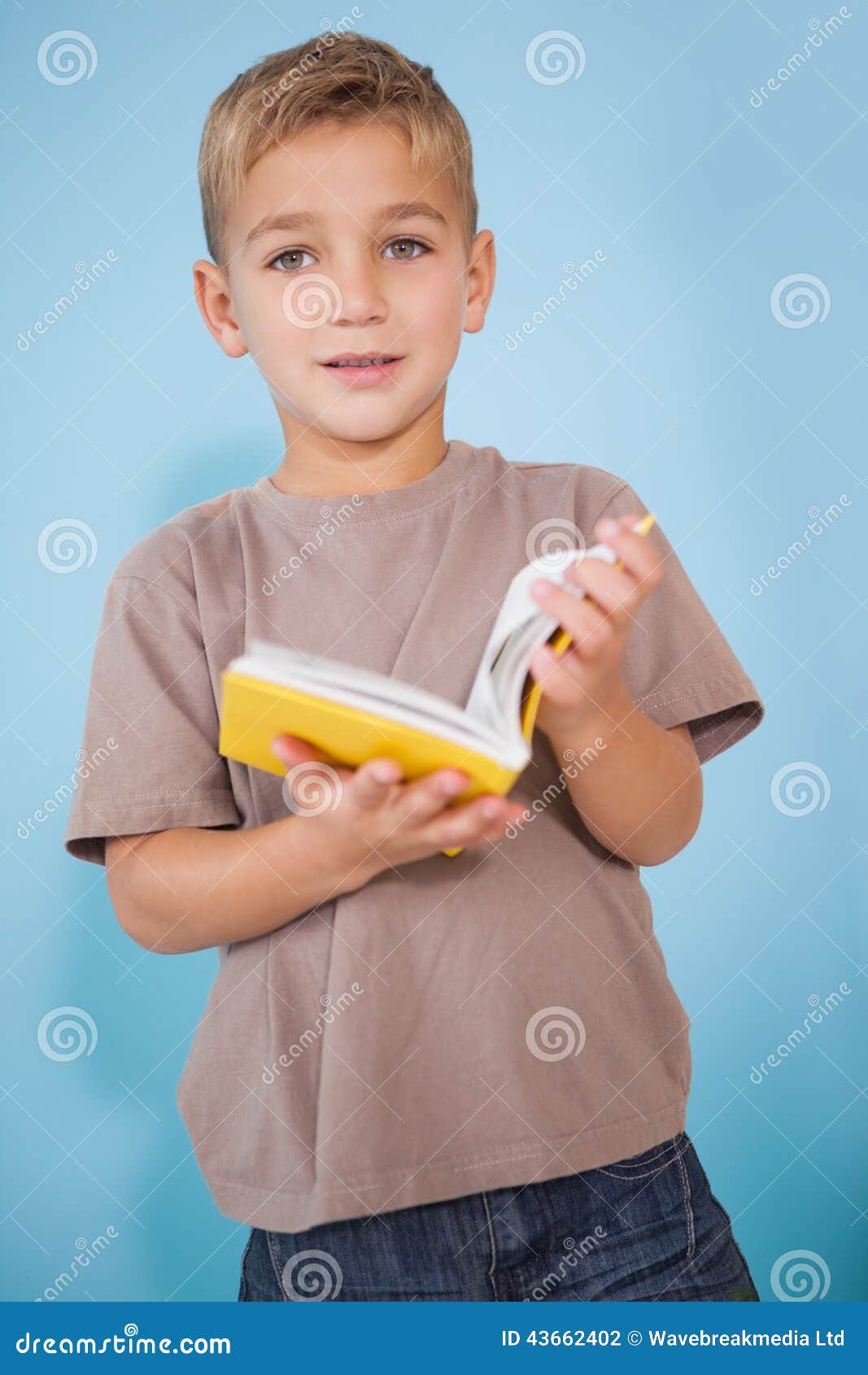 Cute Little Boy Reading in Classroom Stock Photo - Image of camera ...