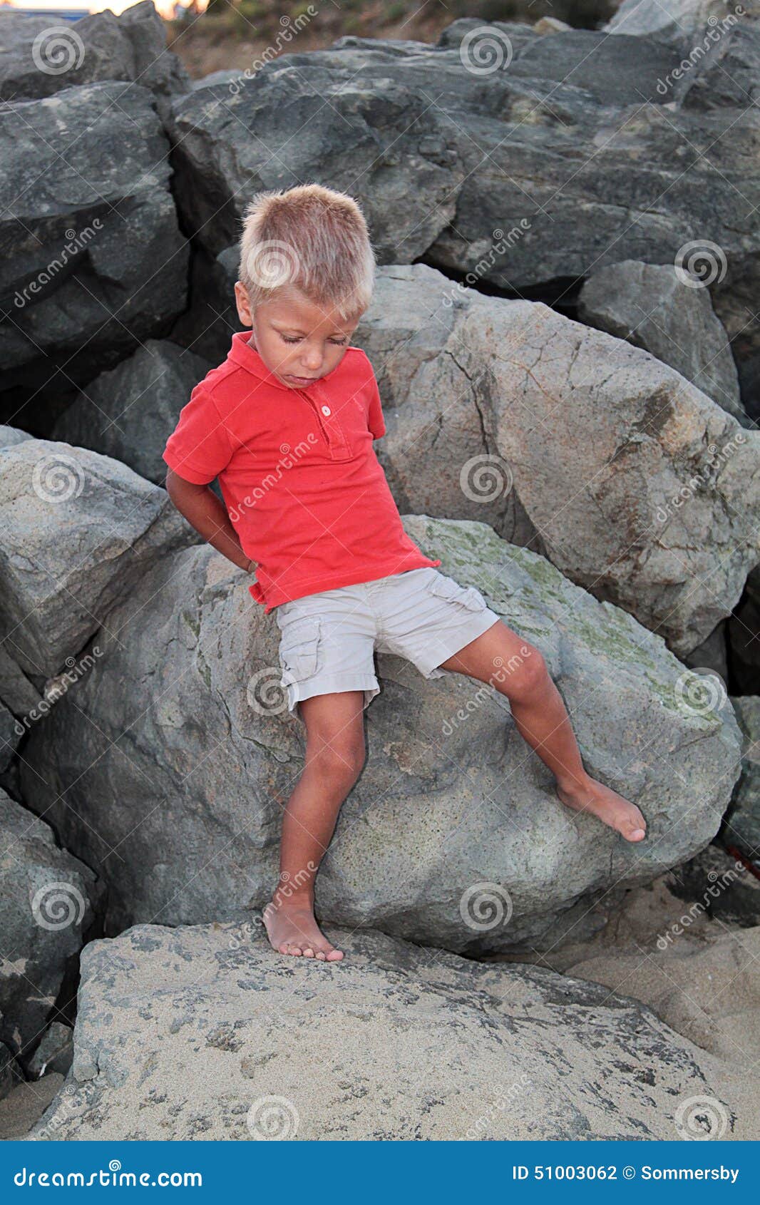 Cute Little Boy on the Rocks Stock Photo - Image of horizontal ...
