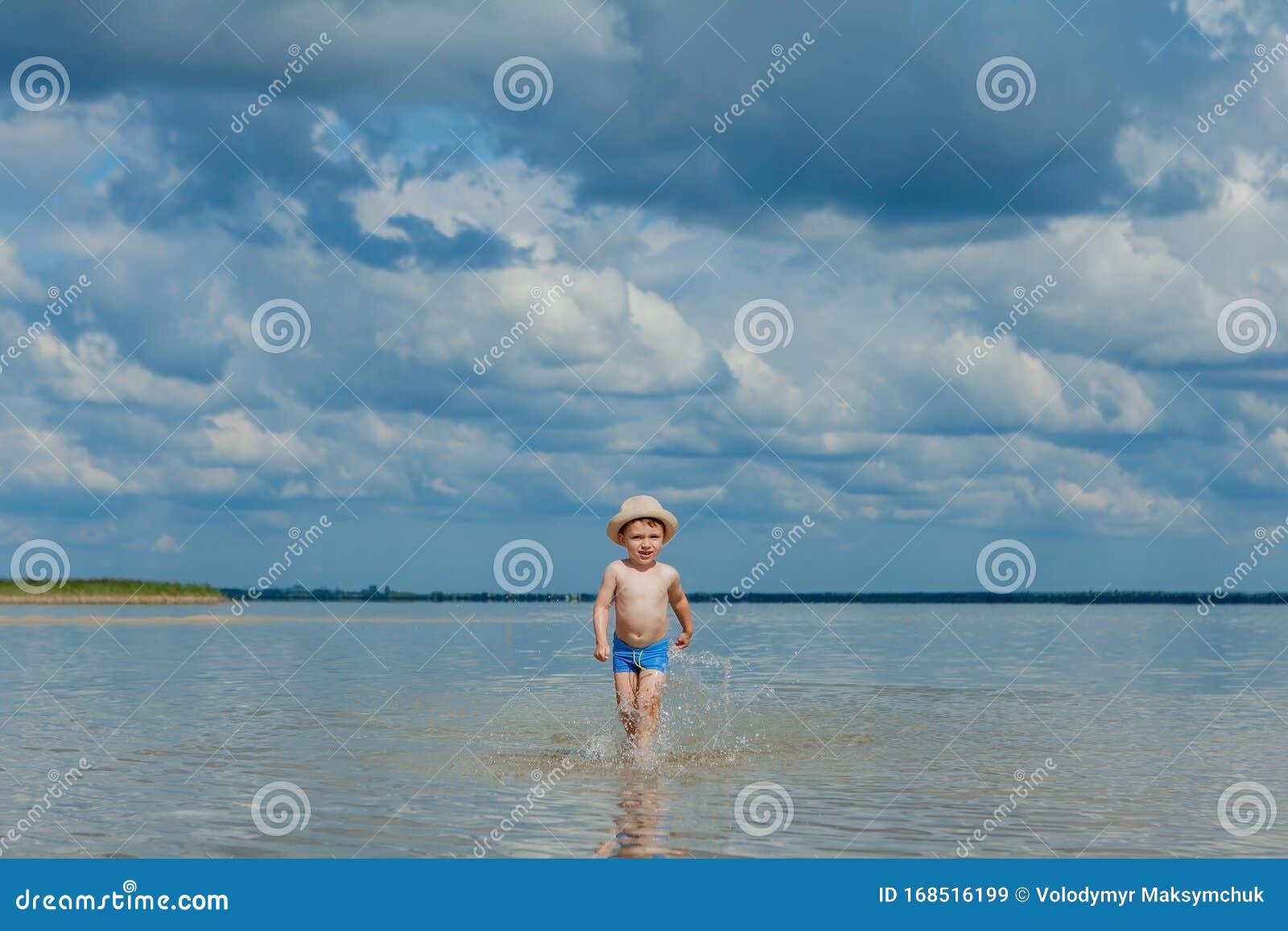 Cute Little Boy Running through the Water at the Beach Stock Image ...