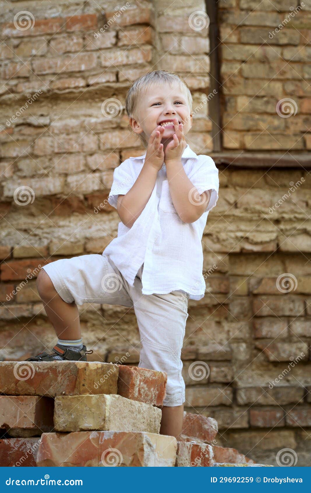 Cute Little Boy Sitting on Bricks Stock Image - Image of blond, bricks ...