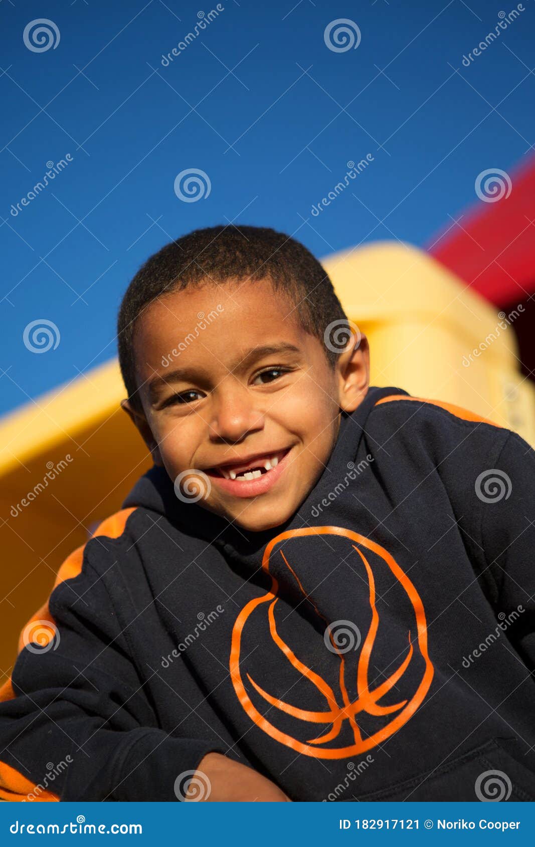 Cute Little Boy on a Slide. Stock Image - Image of smiling, outdoors ...