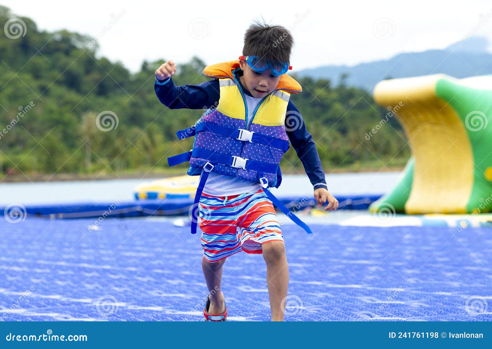 Cute Little Boy Using Float Walking on the Beachfront Play Park Stock ...