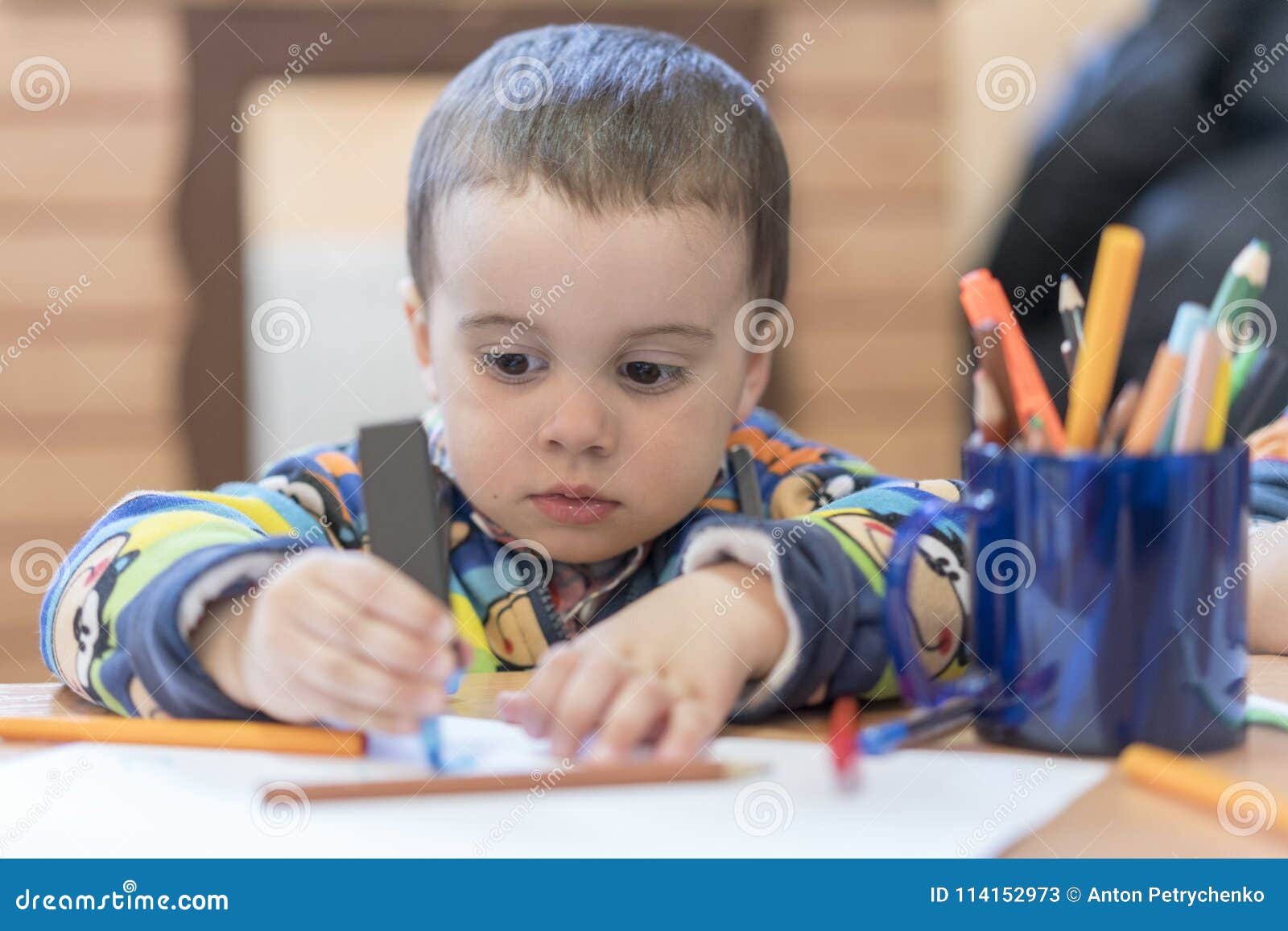 Cute Little Boy Writing Something in Notebook Stock Image - Image of ...