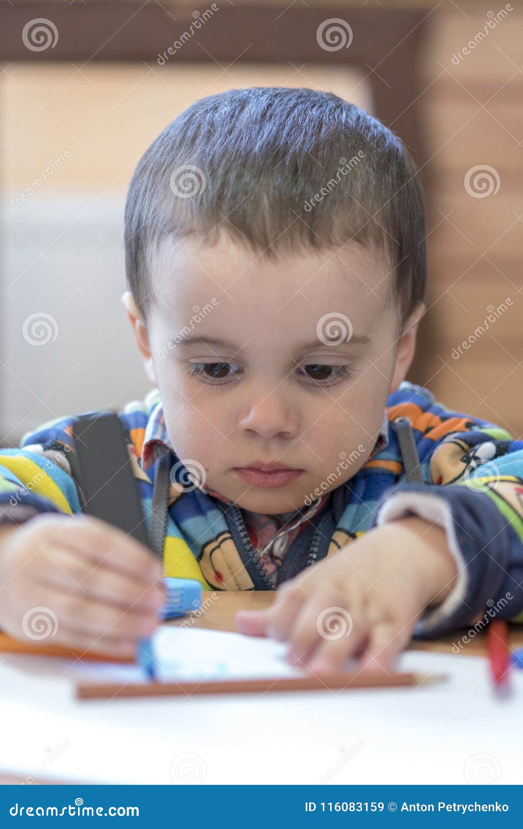 Cute Little Boy Writing Something in Notebook Stock Image - Image of ...