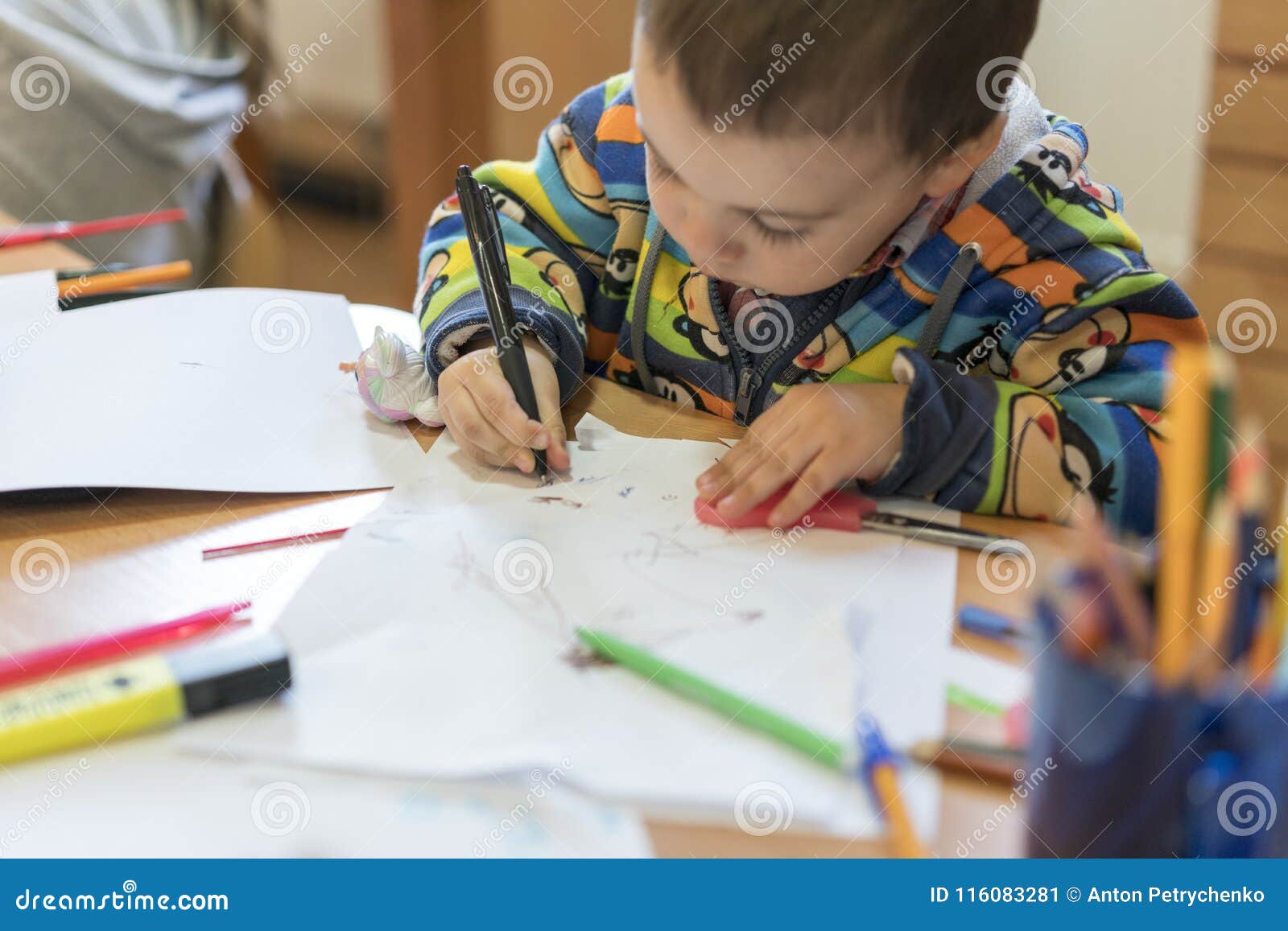 Cute Little Boy Writing Something in Notebook Stock Image - Image of ...