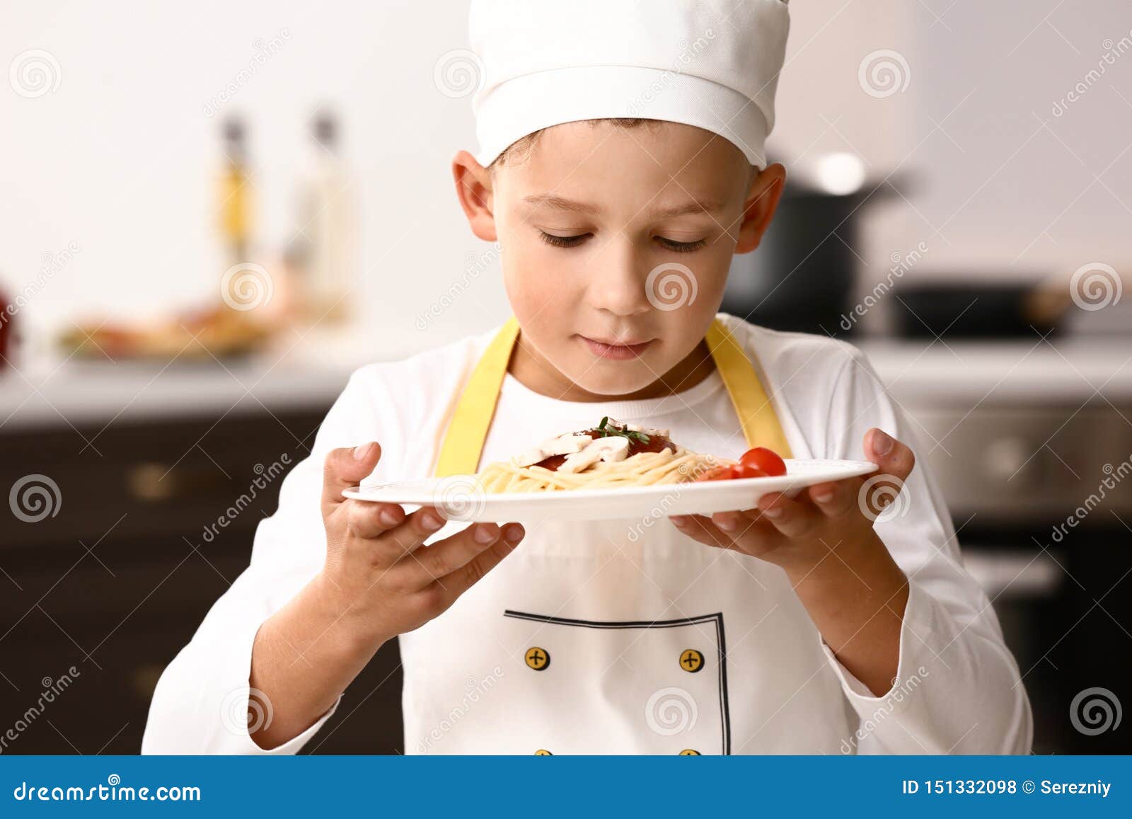 Cute Little Chef with Tasty Dish in Kitchen Stock Photo - Image of ...