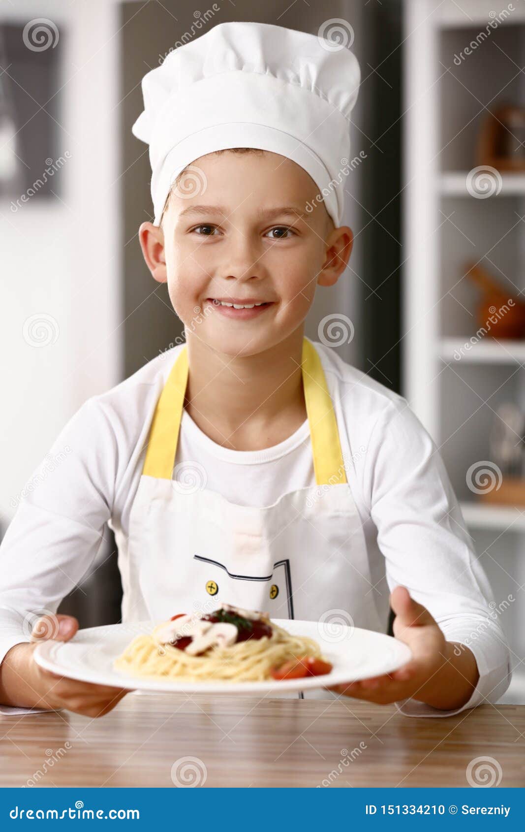Cute Little Chef with Tasty Dish in Kitchen Stock Photo - Image of ...