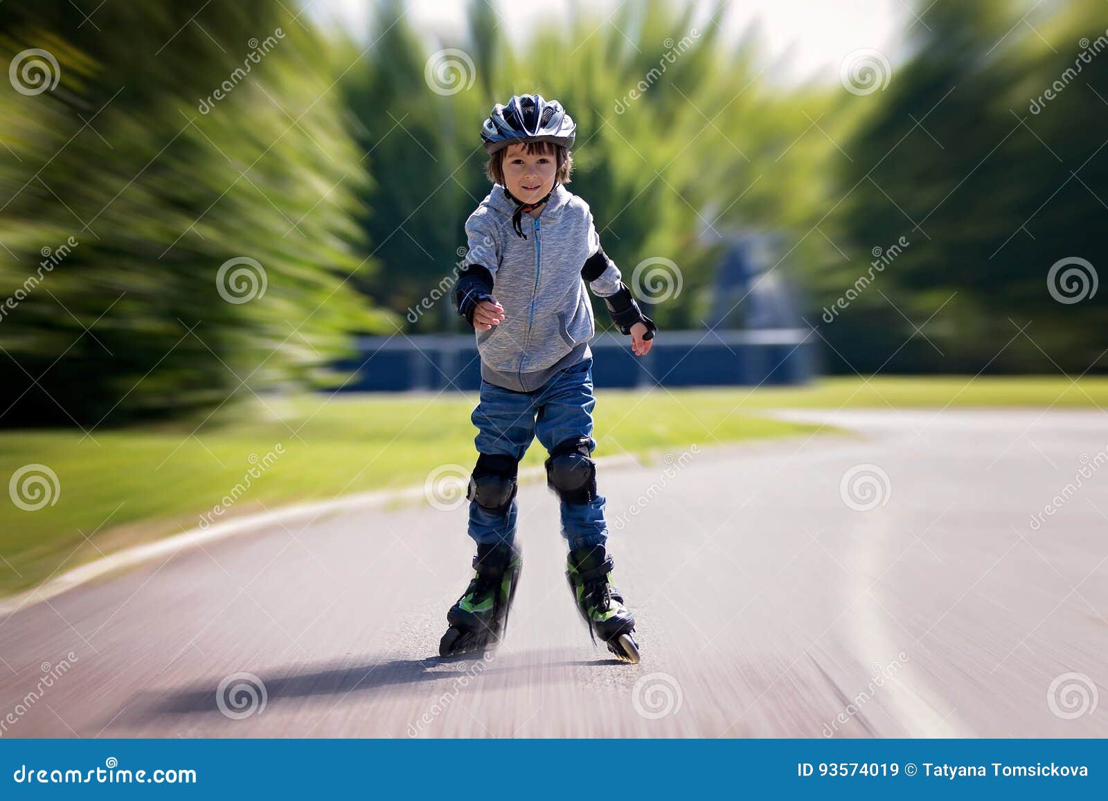 Cute Little Child, Boy, Riding on a Rollerblades in the Park Stock ...