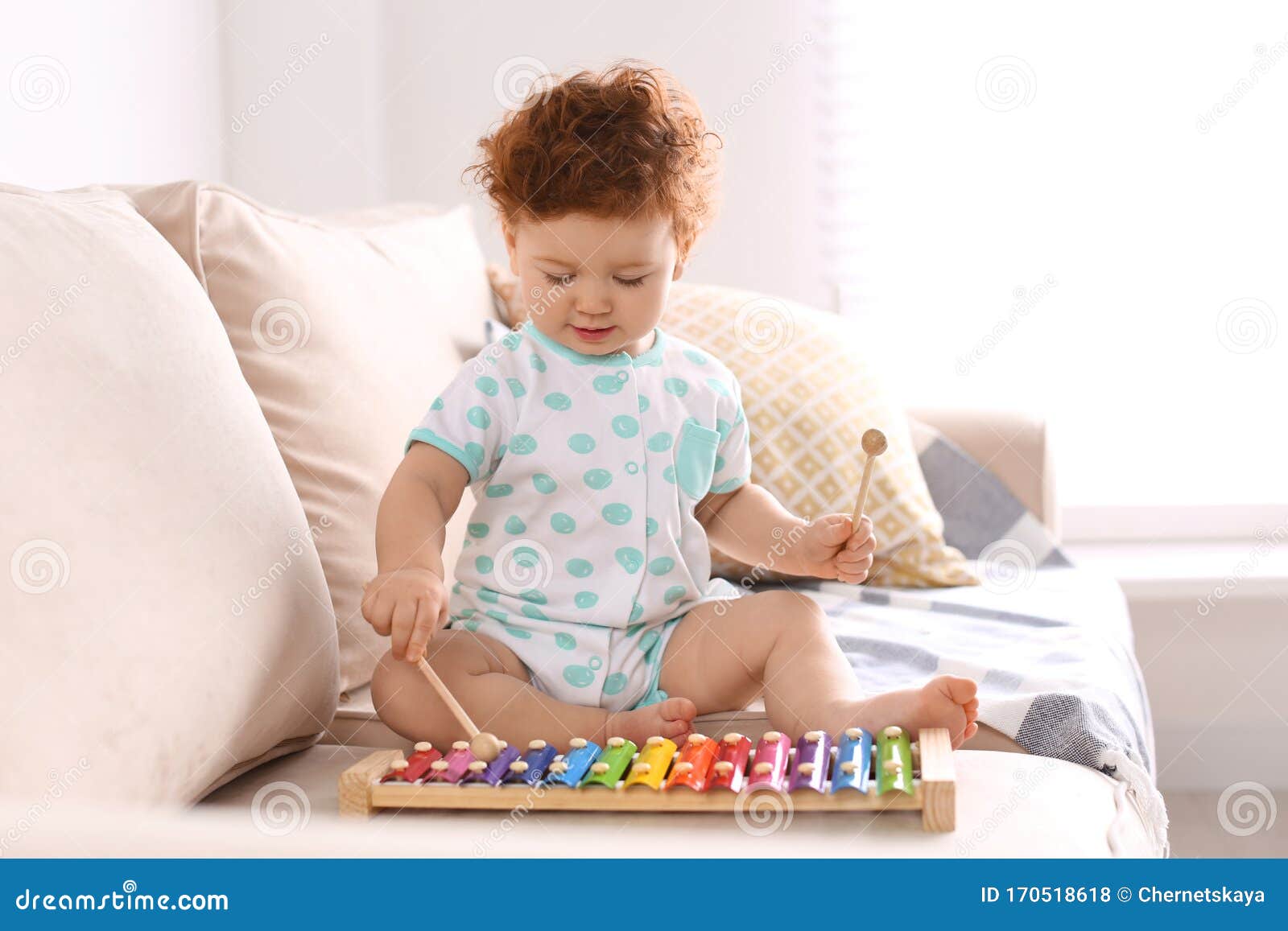 Cute Little Child Playing with Xylophone on Sofa Stock Photo - Image of ...