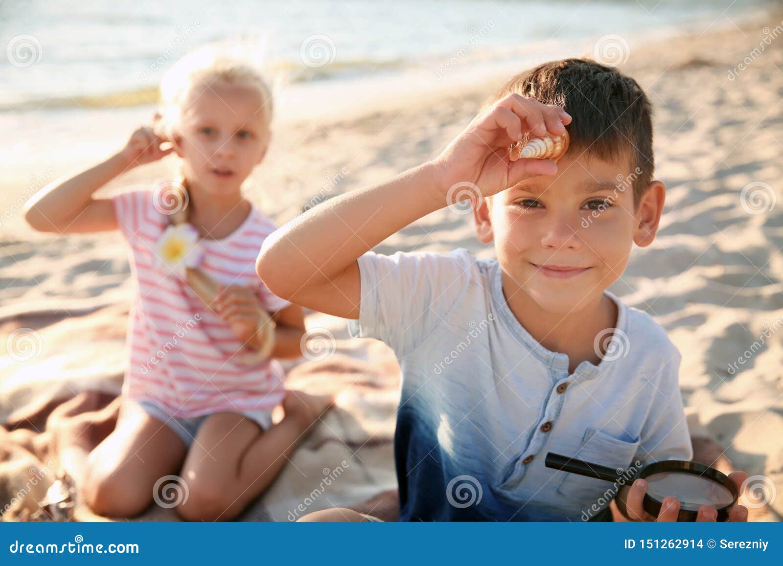 Cute Little Children Playing with Sea Shells on Beach Stock Photo ...