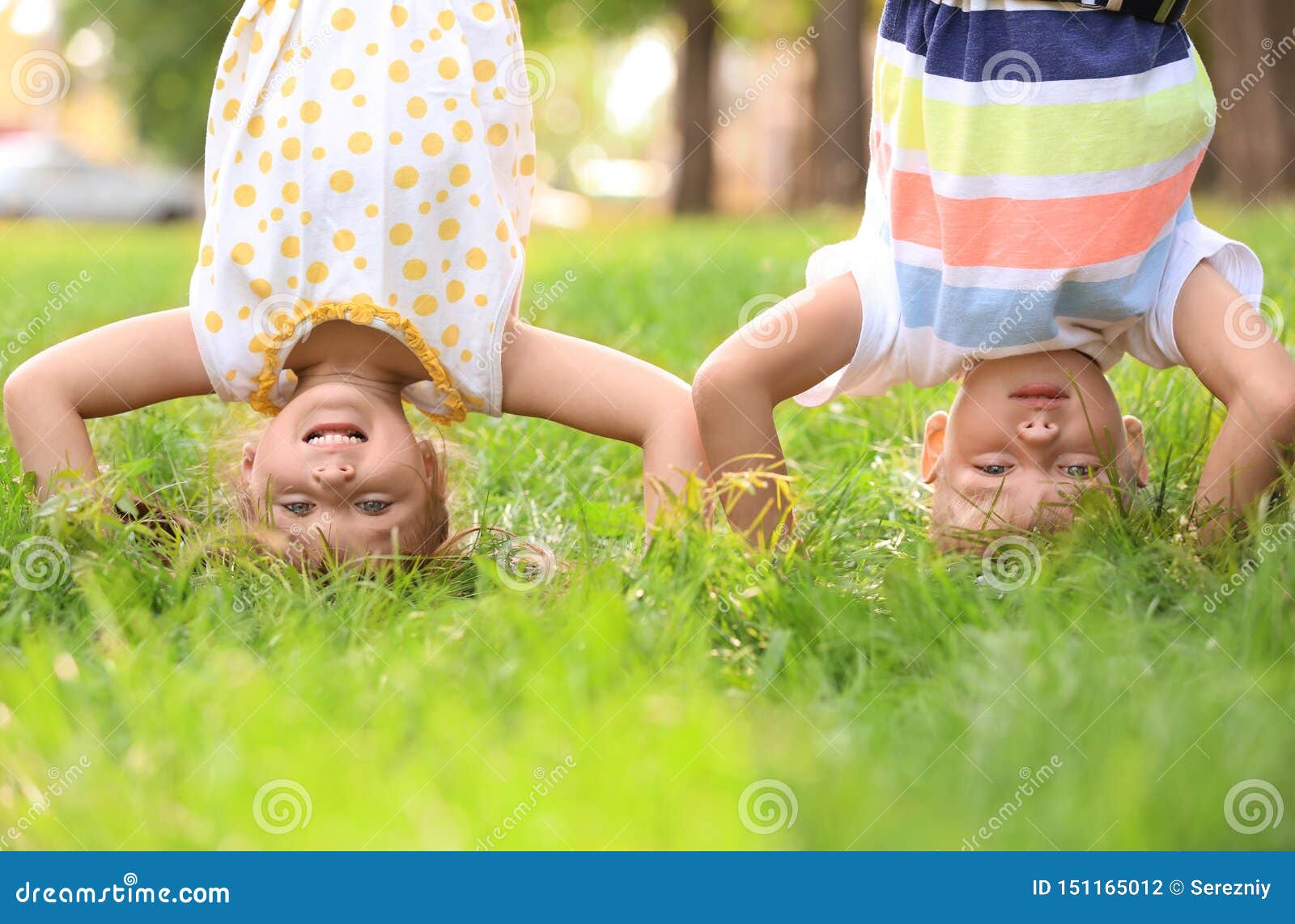 Cute Little Children Standing on Head and Having Fun Outdoors Stock ...