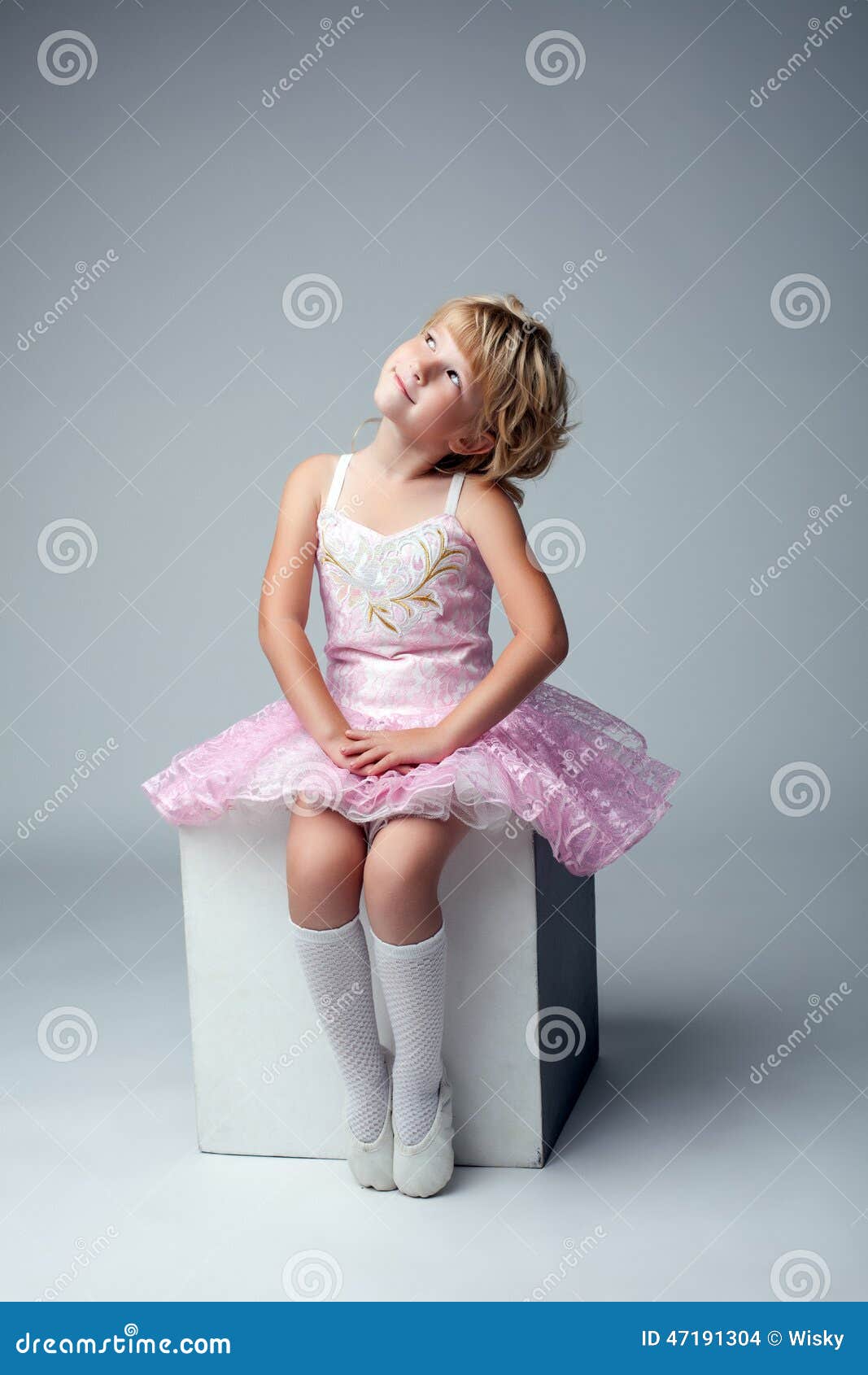 Cute Little Dancer Sitting on Cube in Studio Stock Photo - Image of ...