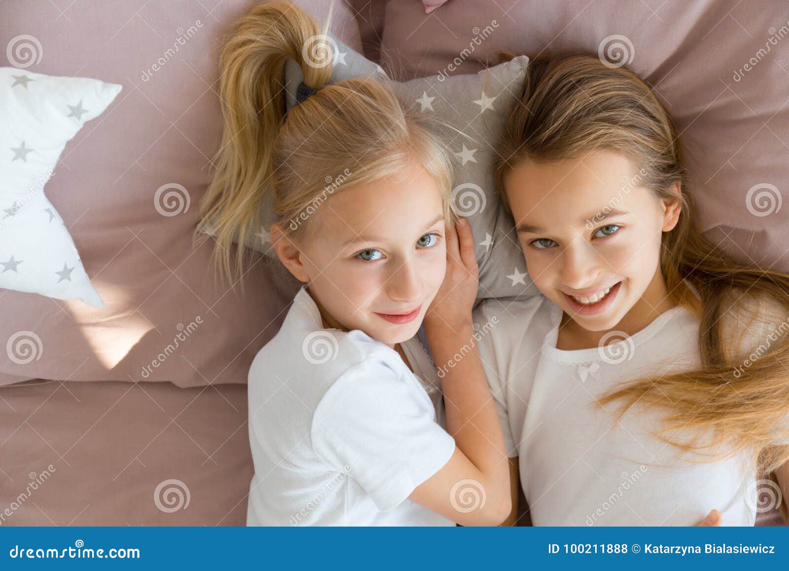 Little Friends Lying in Bed Stock Photo - Image of child, love: 100211888