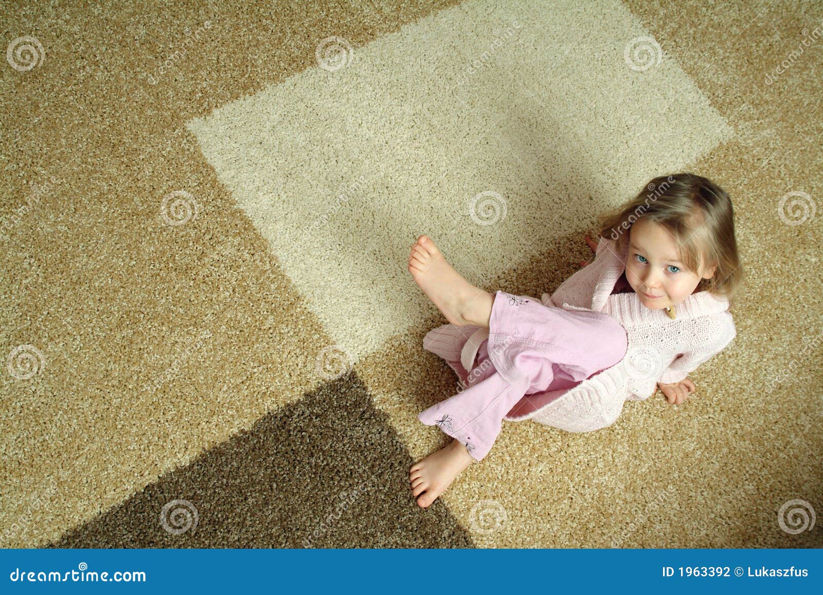 Cute little girl on carpet stock photo. Image of heat - 1963392