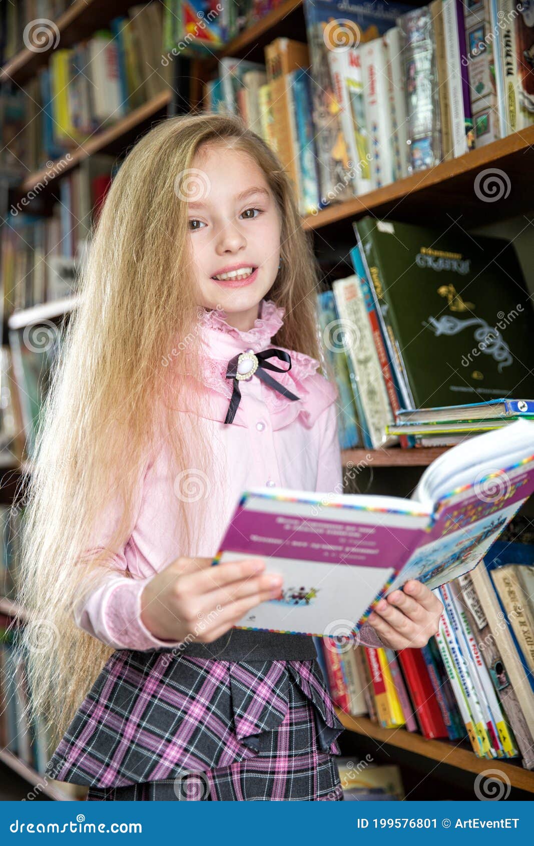 Cute Little Girl Chooses a Book in the Library Stock Image - Image of ...