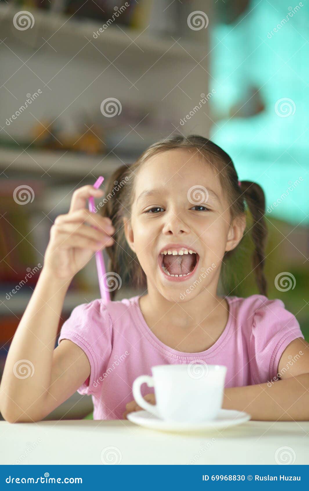 Cute little girl with cup stock photo. Image of eating - 69968830