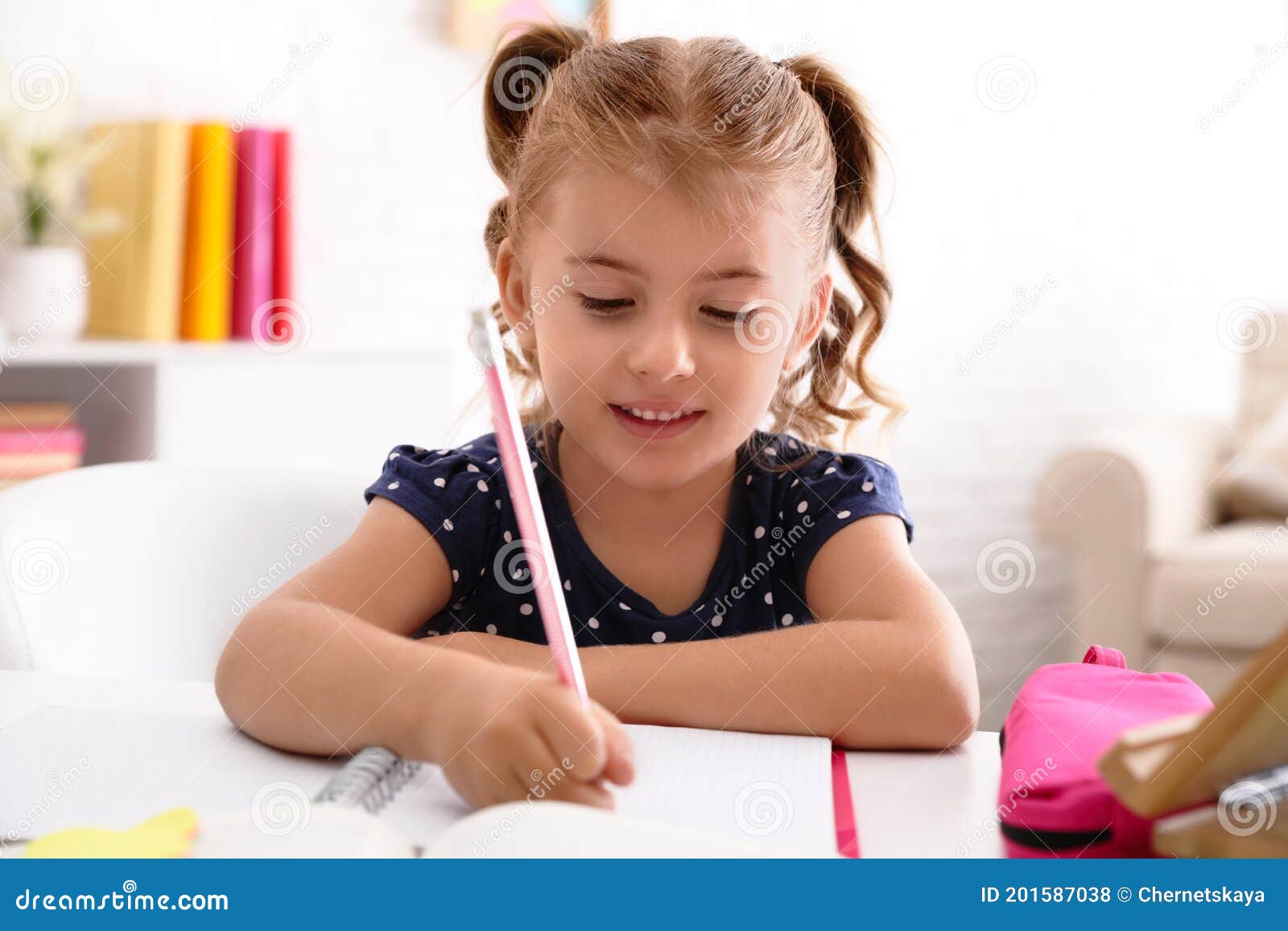 Cute Little Girl Doing Homework at Table Stock Photo - Image of indoors ...