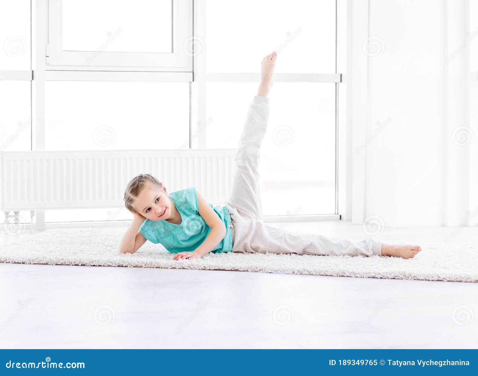 Little girl doing workout stock image. Image of exercises - 189349765