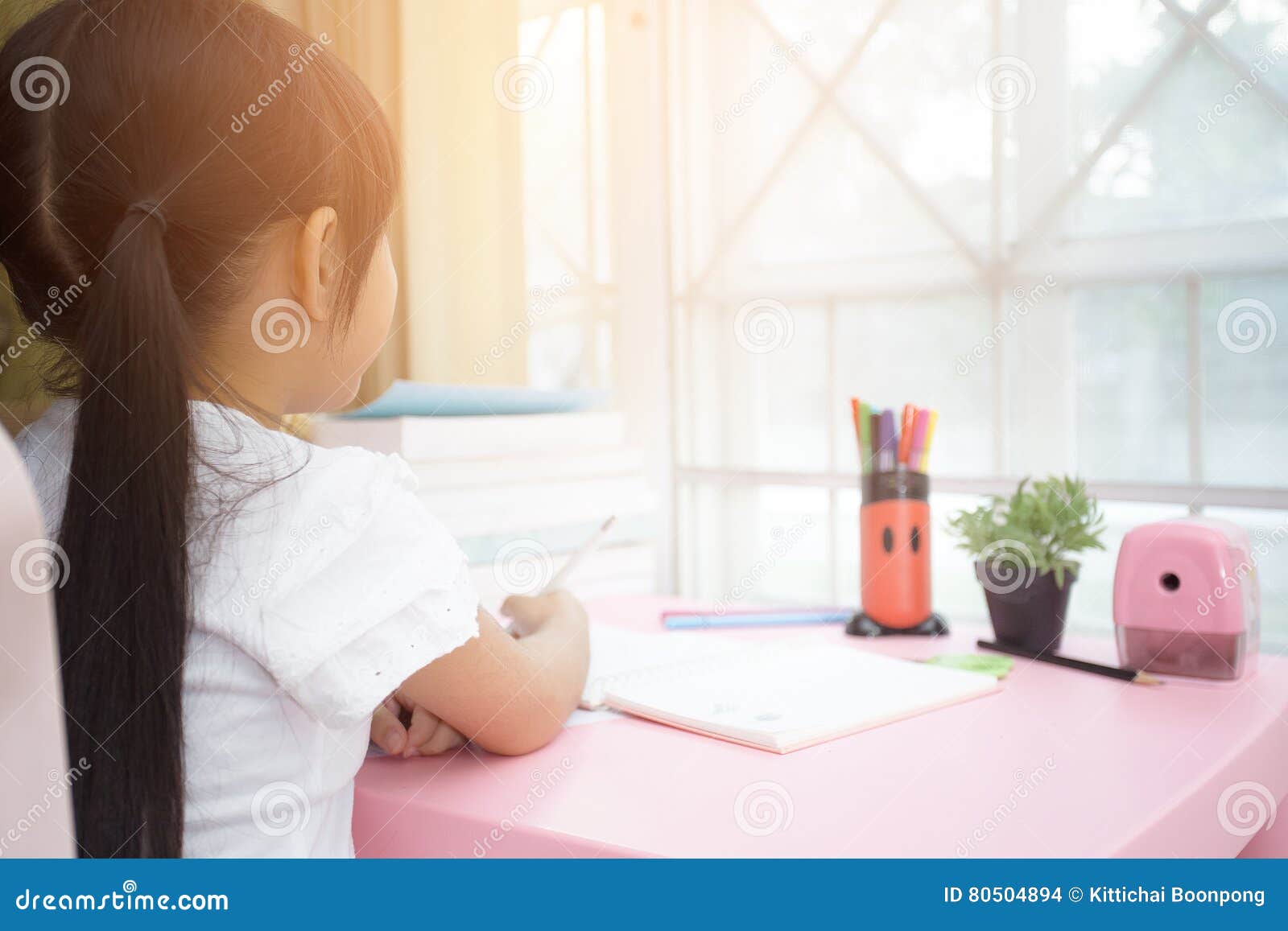 Cute Little Girl Drawing Picture Using Her Imagination Stock Photo ...