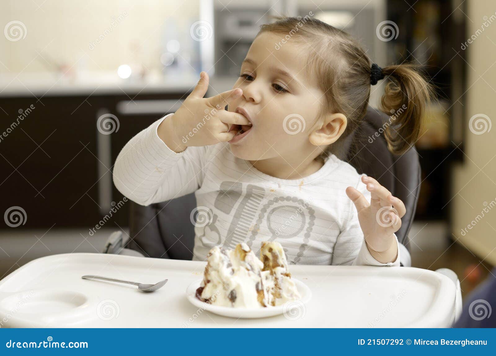 Cute little girl eating stock photo. Image of foot, small - 21507292