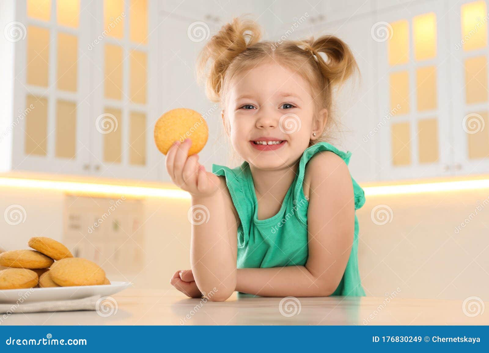 Cute Girl Eating Cookies in Kitchen Stock Image - Image of girl, home ...