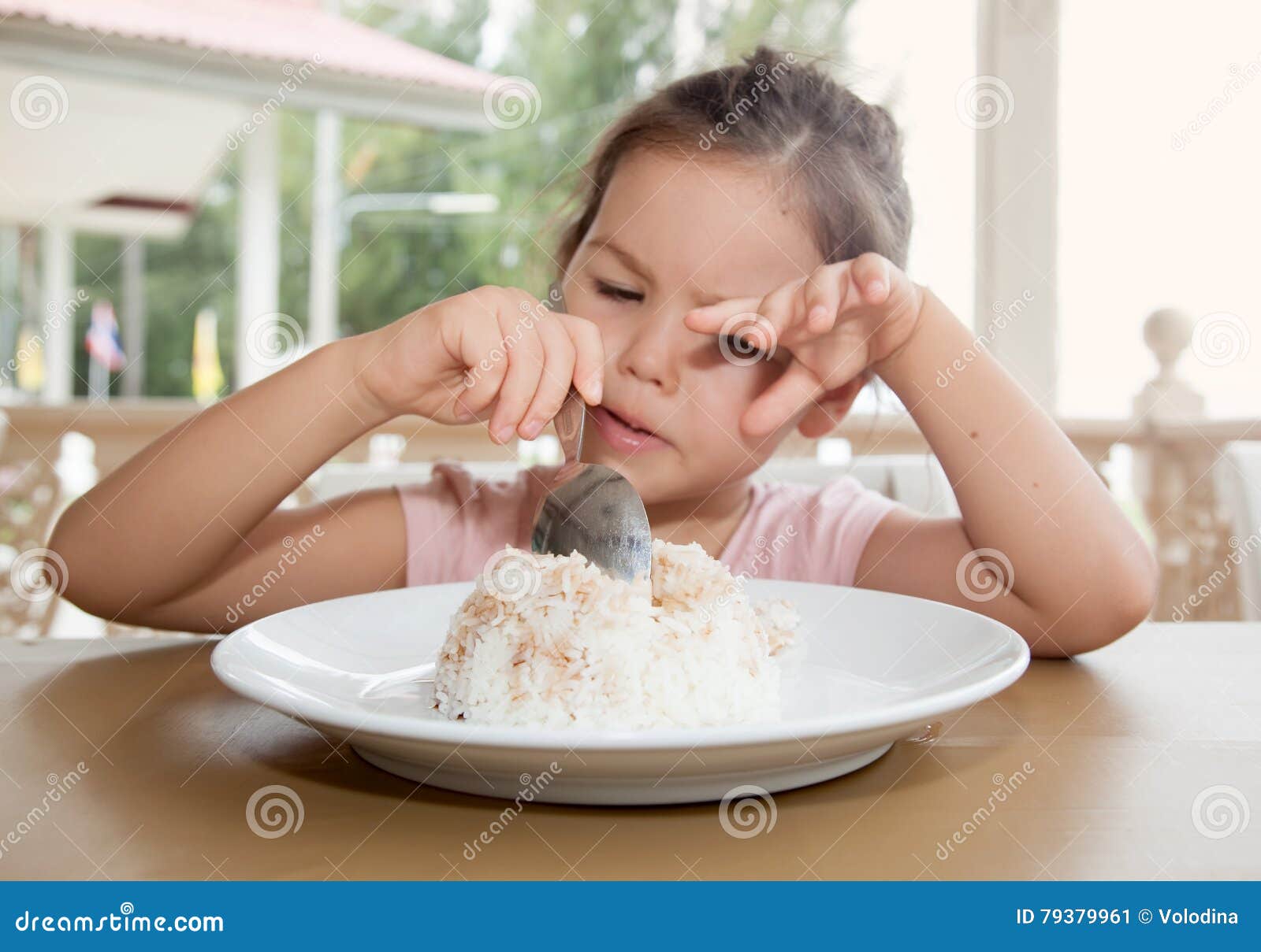 Cute Little Girl Eats Rice in a Summer Cafe Stock Image - Image of food ...