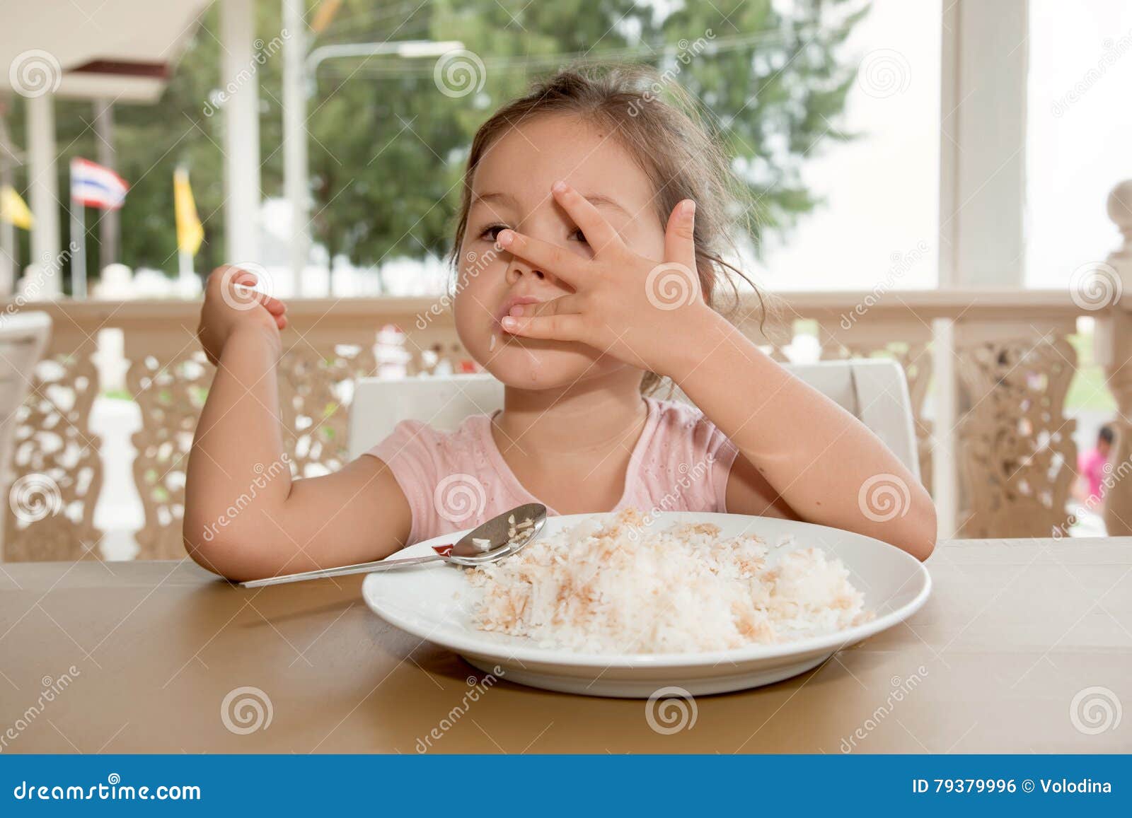 Cute Little Girl Eats Rice in a Summer Cafe Stock Photo - Image of food ...