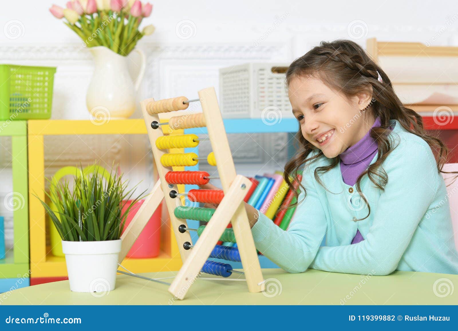 Girl playing with abacus stock photo. Image of head - 119399882