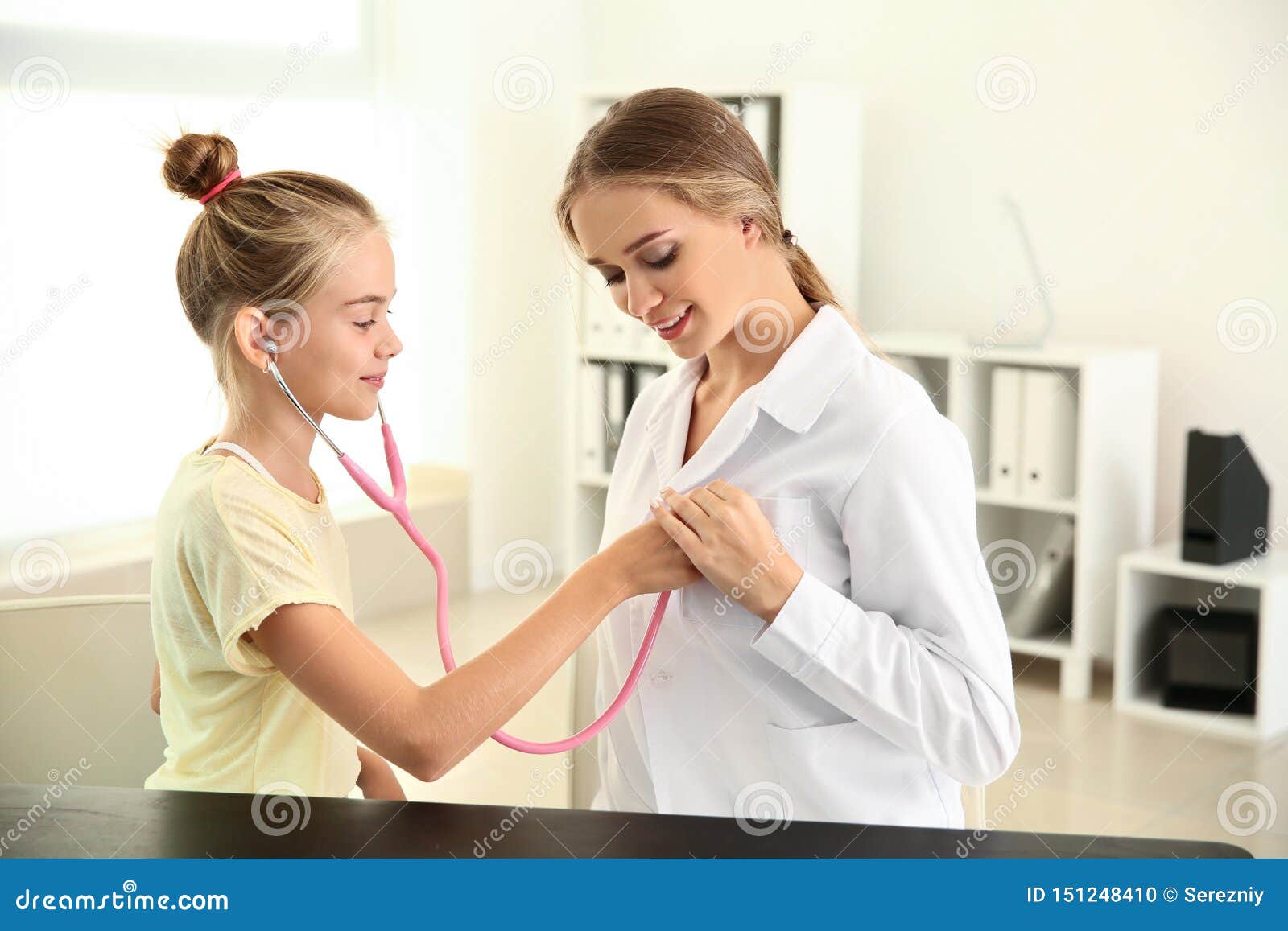 Cute Little Girl Listening Doctor S Heartbeat by Using Stethoscope in ... Cute Little Girl Listening Doctor S Heartbeat by Using Stethoscope in ...