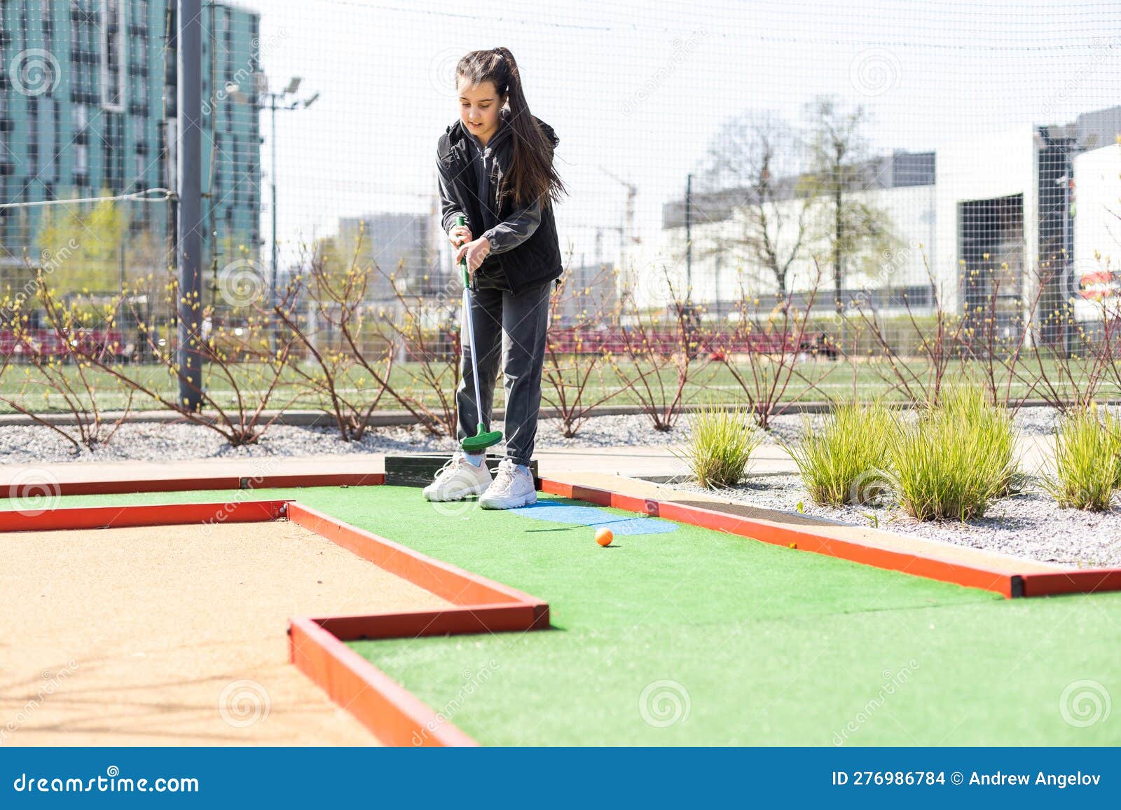 Cute Little Girl on a Miniature Golf Course. Stock Photo - Image of ...