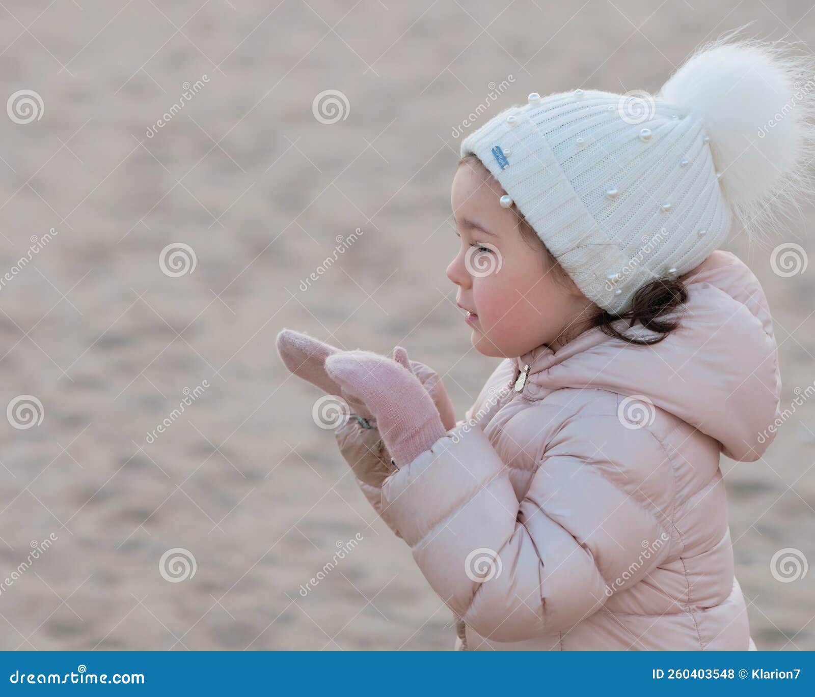 Cute Little Girl is Playing on an Empty Beach on a Cold Day Stock Photo ...