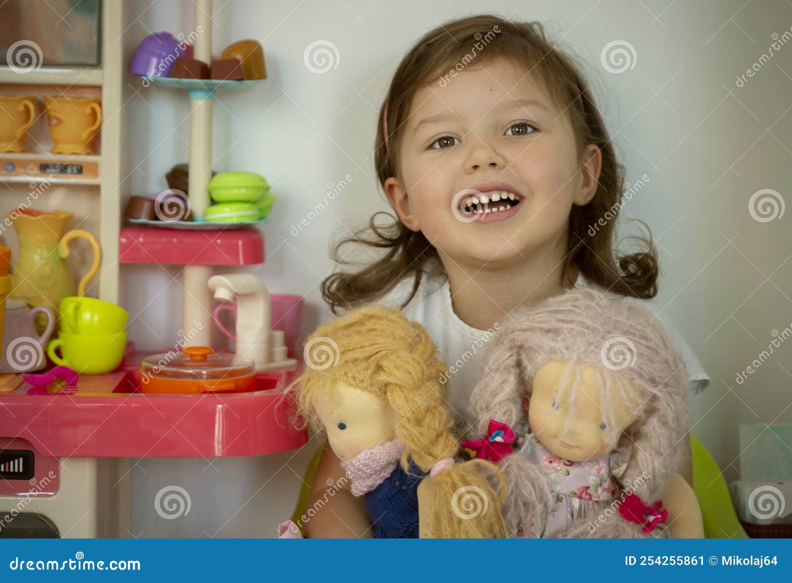 Cute Little Girl Playing with Her Dolls Stock Image - Image of ...