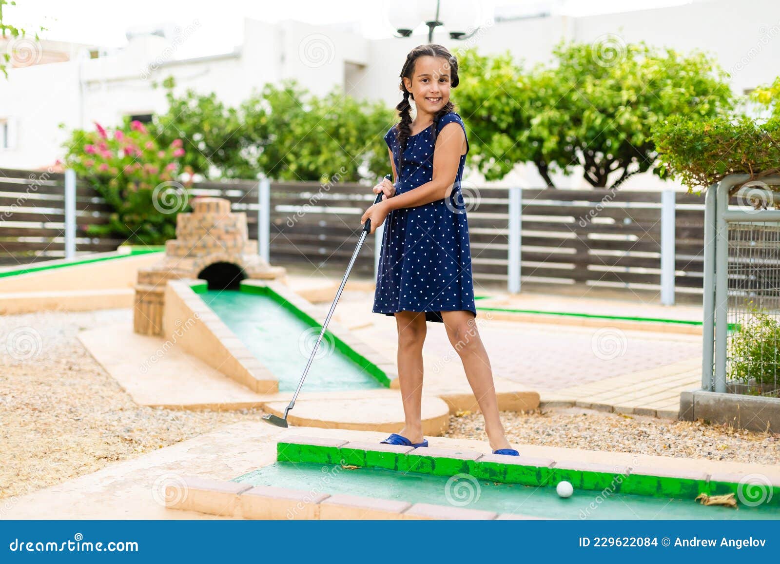 Cute Little Girl Playing Mini Golf in a Park Stock Photo - Image of ...
