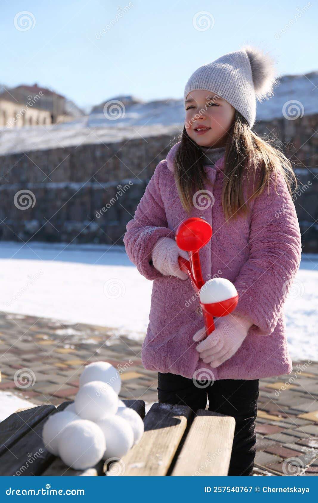 Cute Little Girl Playing with Snowball Maker Outdoors Stock Image ...