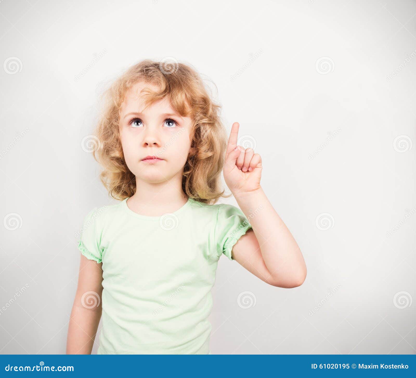 Cute Little Girl Pointing Up Stock Photo - Image: 61020195