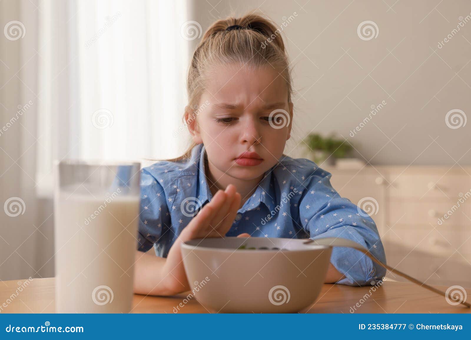 Cute Little Girl Refusing To Eat Her Breakfast at Home Stock Image ...