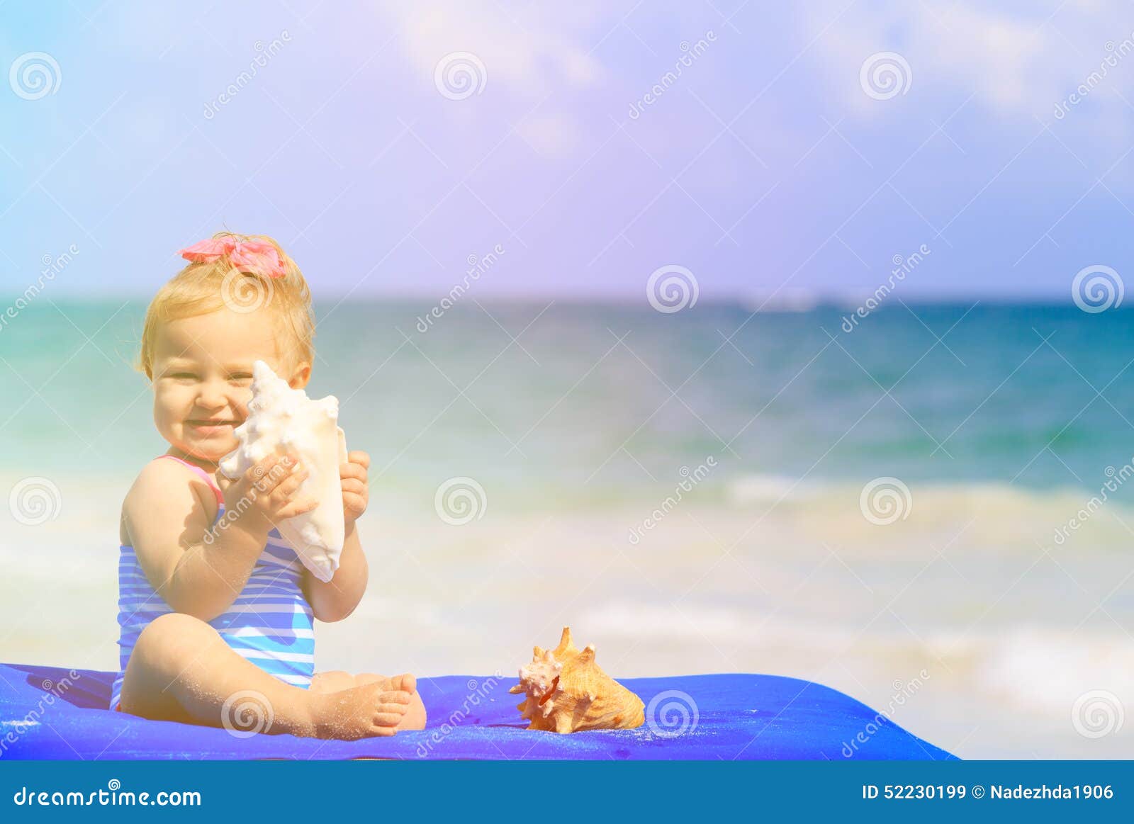 Cute Little Girl With Seashells On The Beach Stock Image ...