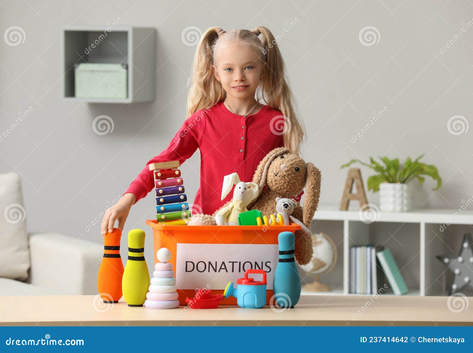 Cute Little Girl Sorting Donation Box at Home Stock Photo - Image of ...
