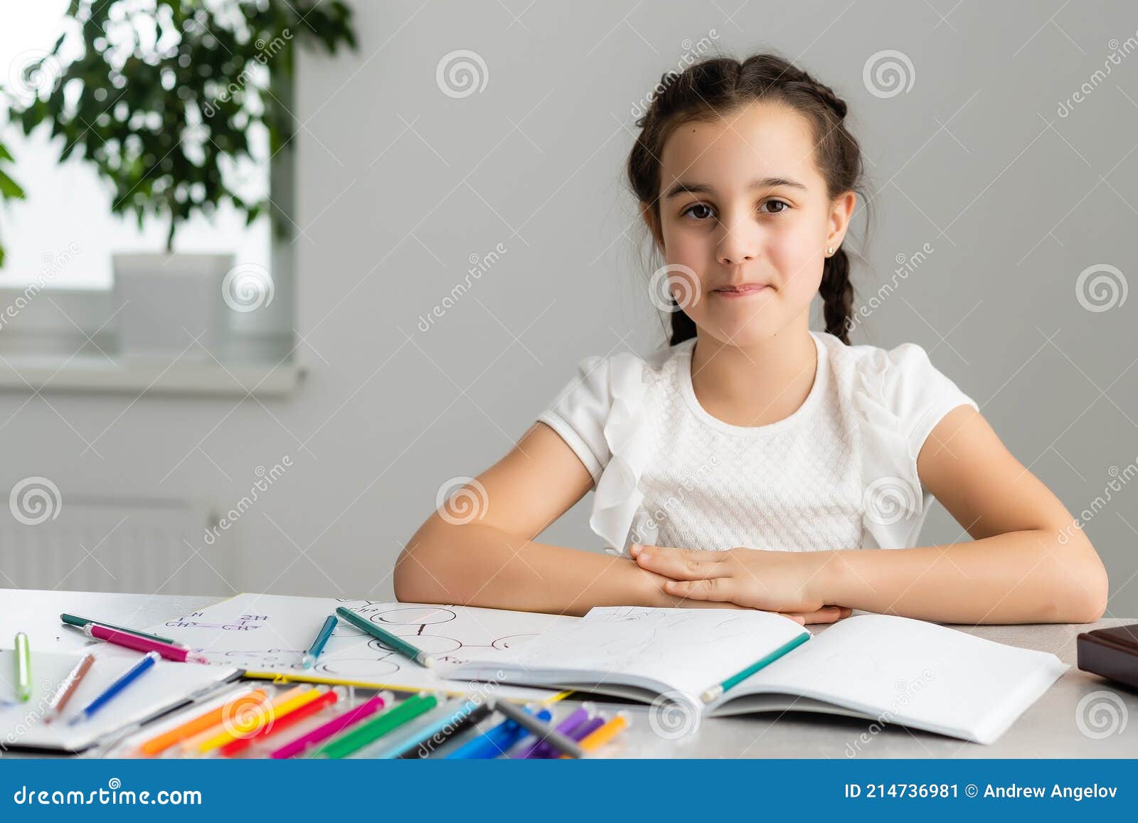 Cute Little Girl Studying at Home and Smiling Stock Image - Image of ...