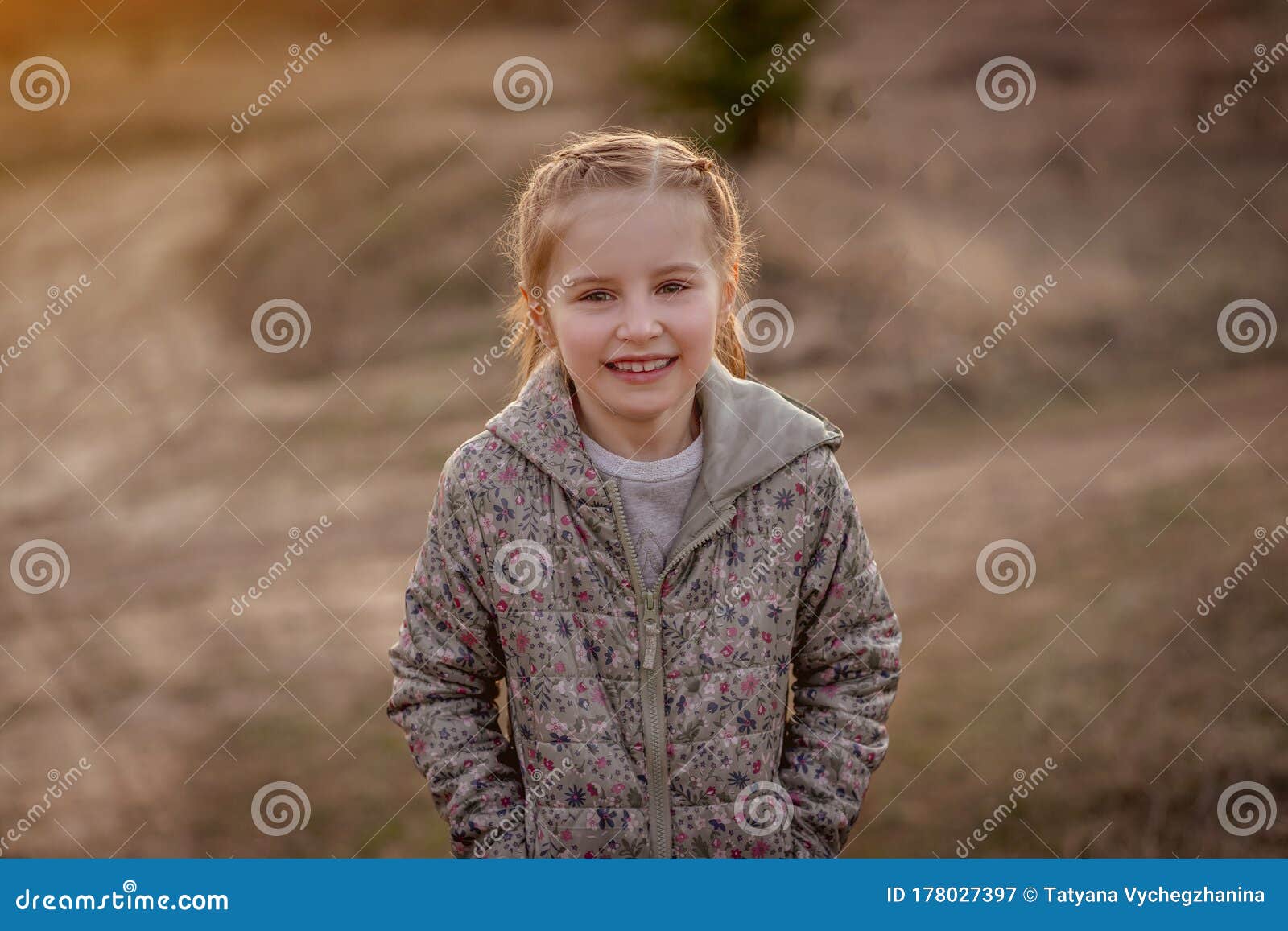Cute little girl at sunset stock image. Image of girl - 178027397