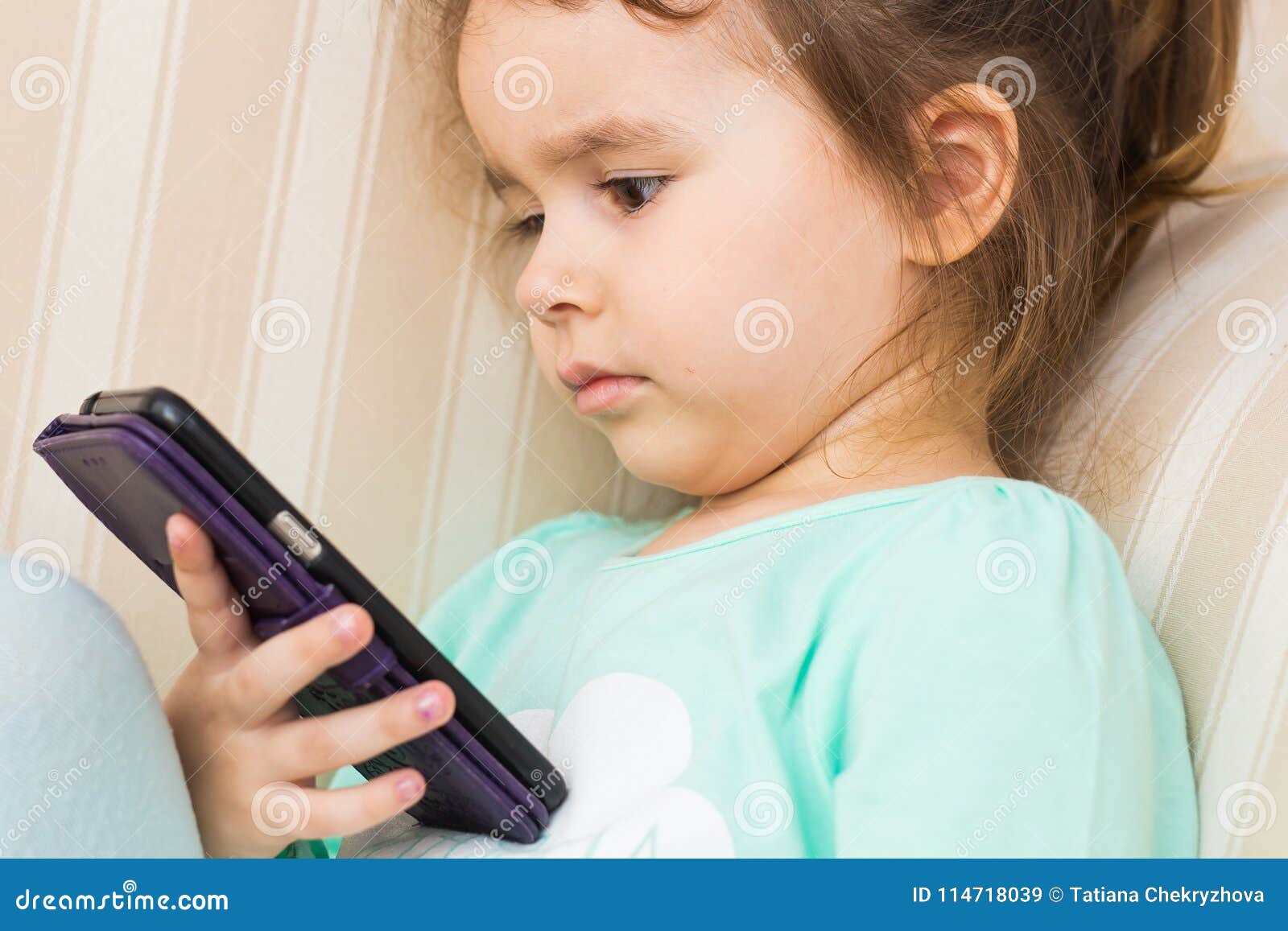 Cute Little Girl Using Modern Smartphone Stock Image - Image of looking ...