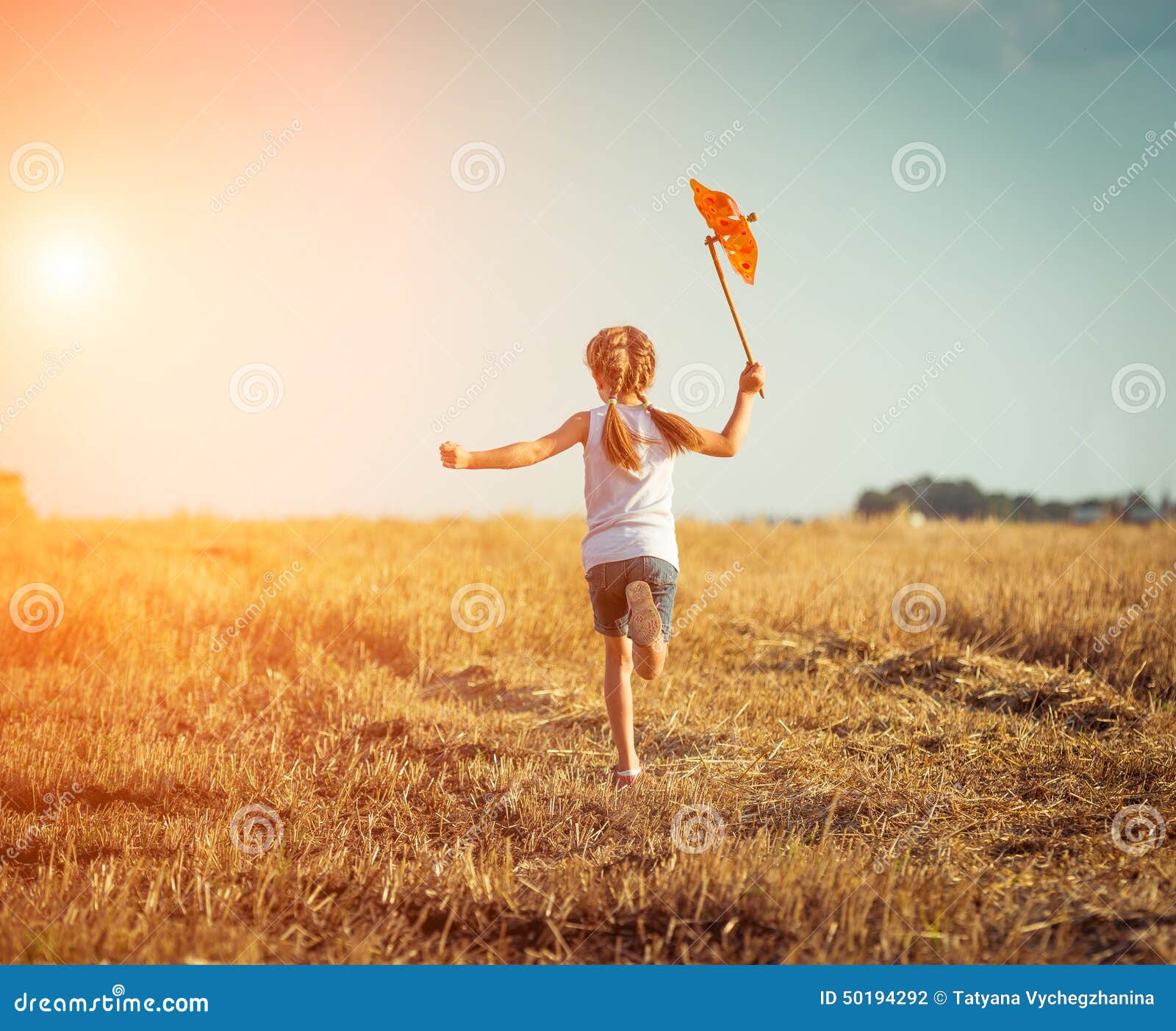 Cute Little Girl with a Windmill Stock Photo - Image of girl, cute ...