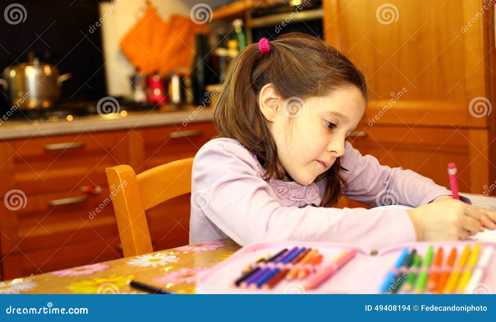 Cute Little Girl Writes on Her Notebook Stock Photo - Image of activity ...