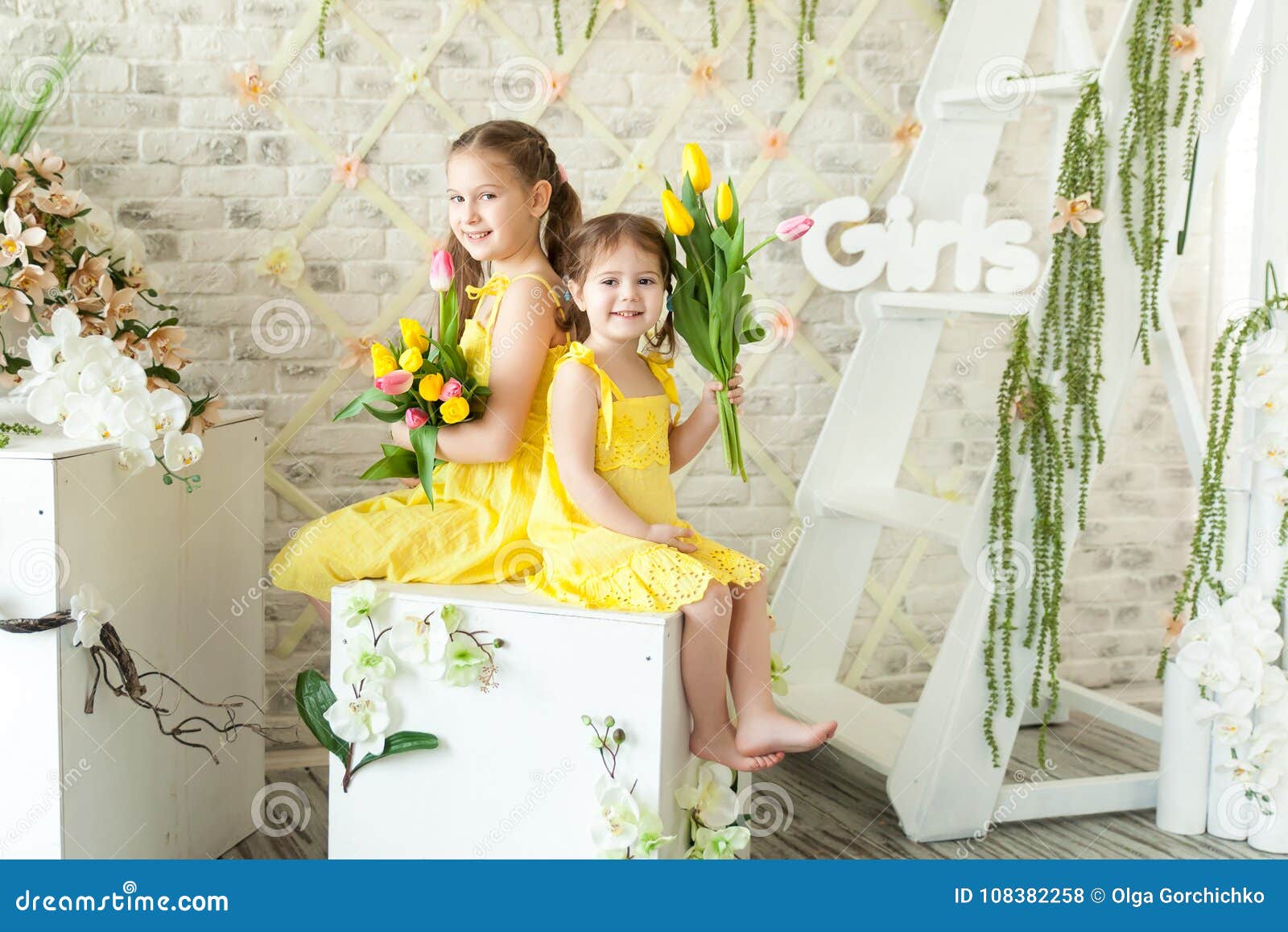Cute Little Girls in Spring Studio Stock Photo - Image of bouquet ...