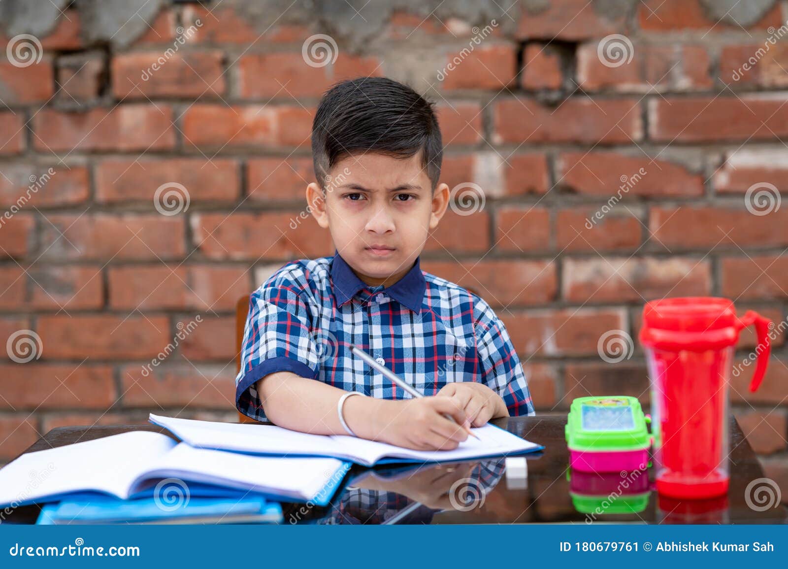 Cute Little Indian/Asian School Kid Studying on Study Table , Writing ...
