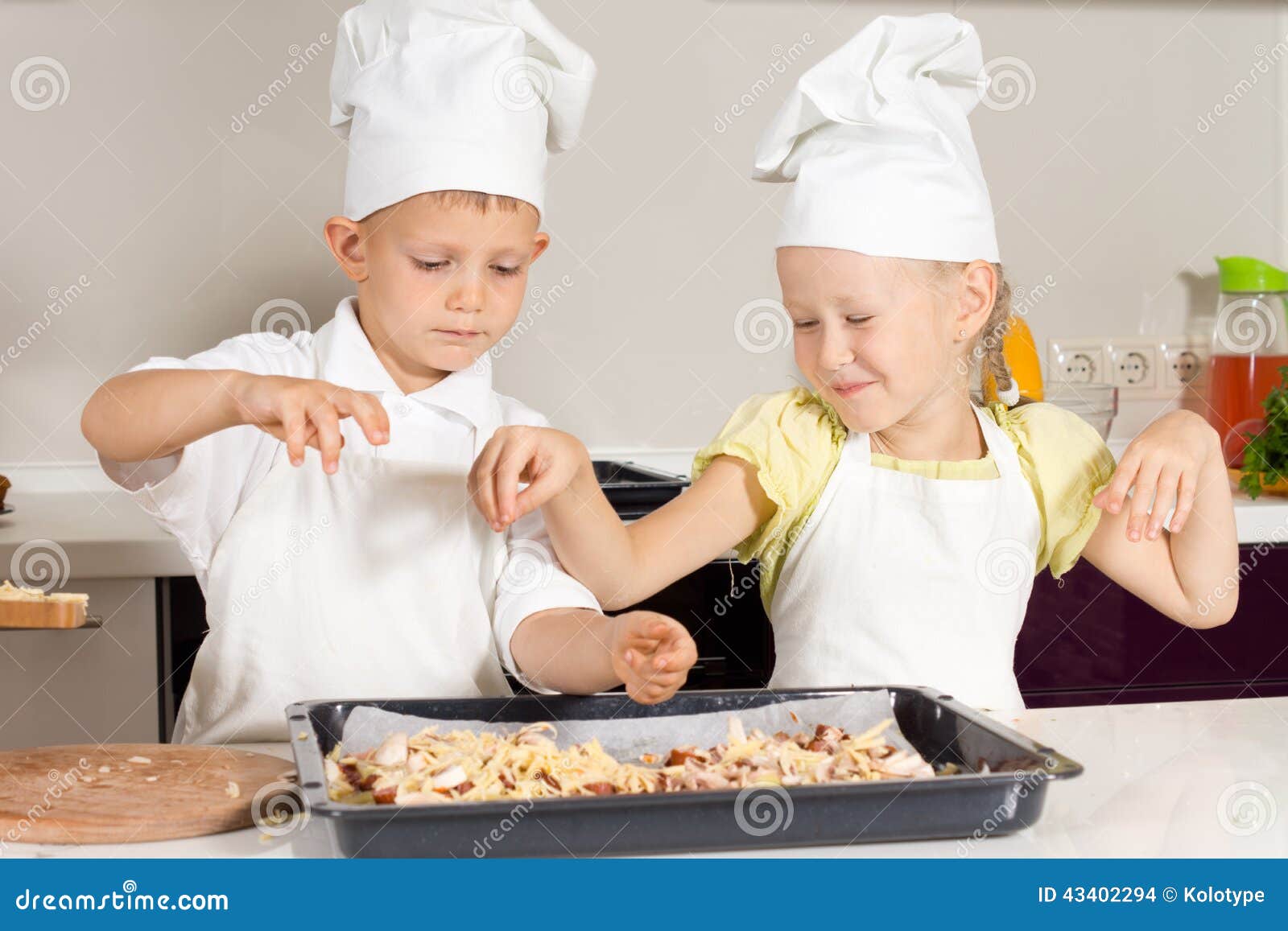 Cute Little Kid Chefs Putting Ingredients on Pizza Stock Photo - Image ...