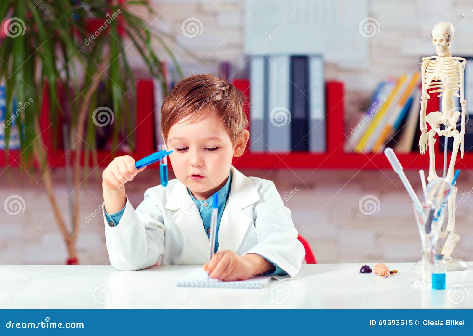 Cute Little Scientist Writing Notes about Experiments in Lab Stock ...