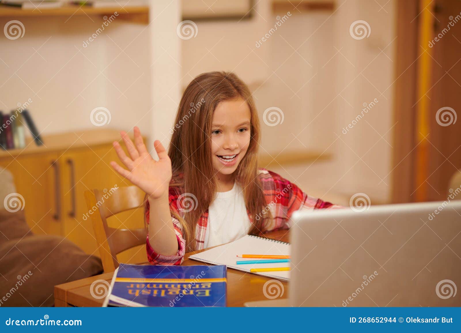 A Cute Long-haired Girl Having an Online Tutorial Stock Photo - Image ...